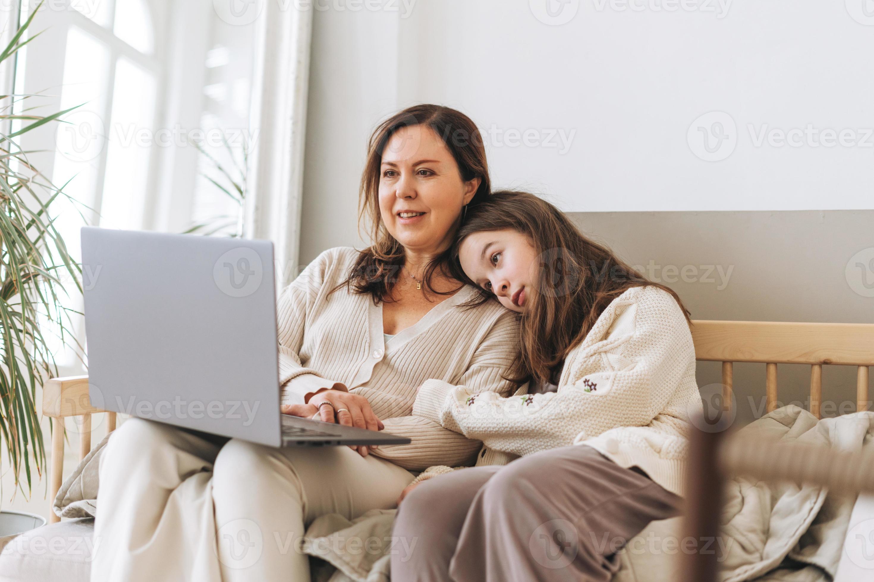 Mother Middle Aged Woman And Daughter Teenager Using Laptop Together In
