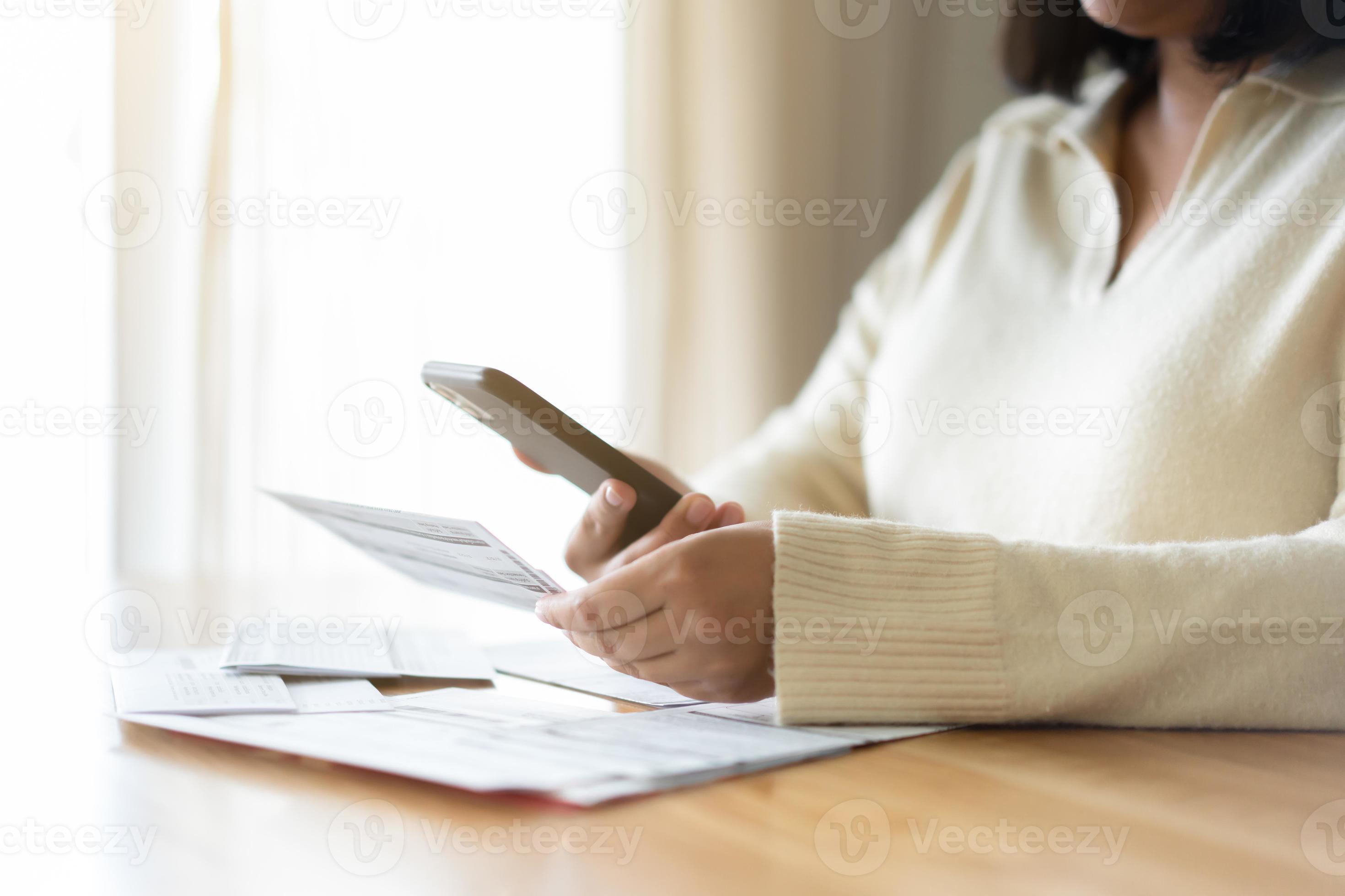 Woman paying bills using mobile phone. Cashless payment concept ... Woman paying bills using mobile phone. Cashless payment concept ...