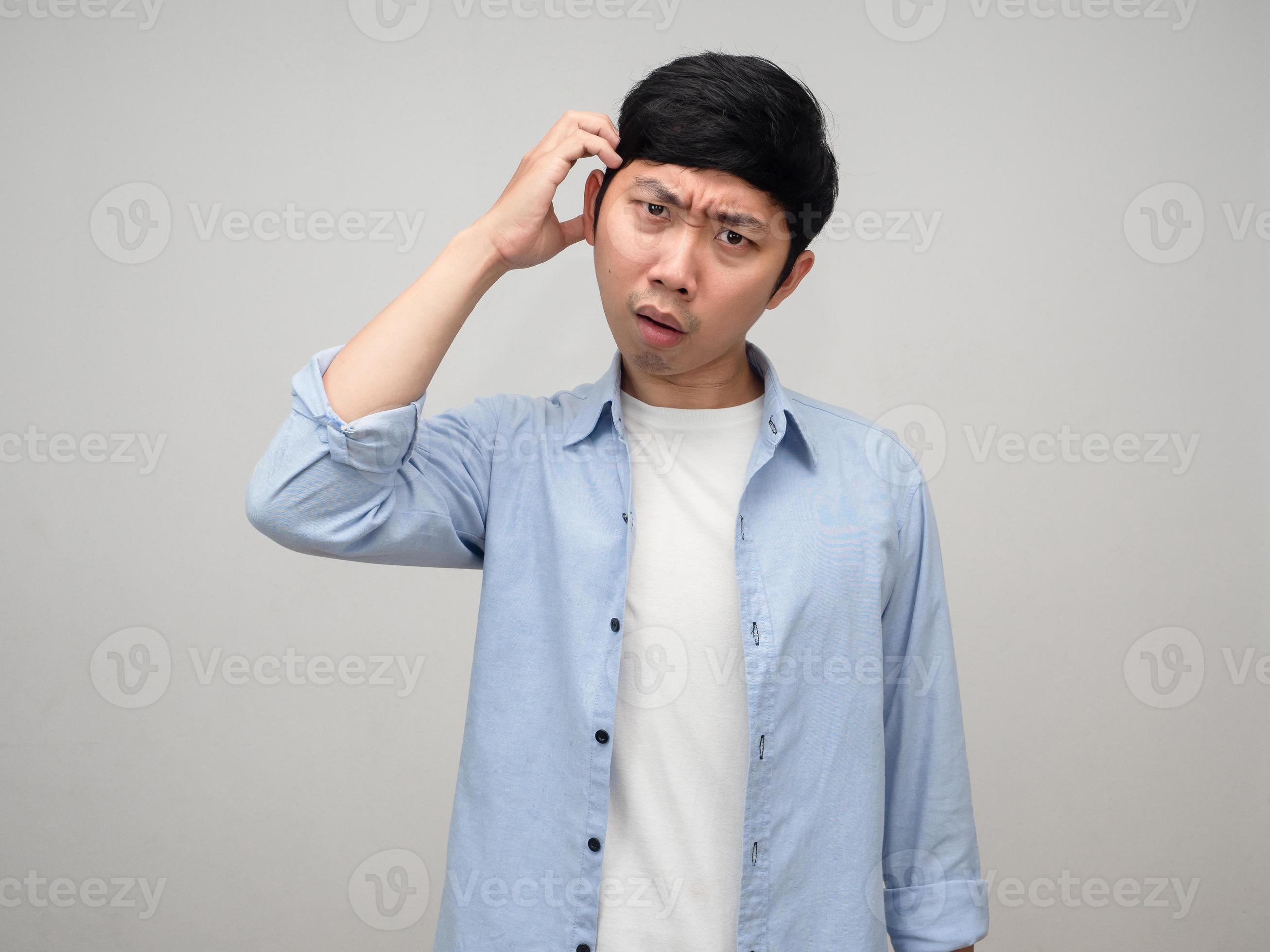 Young asian man blue shirt gesture scratch head confused isolated ...