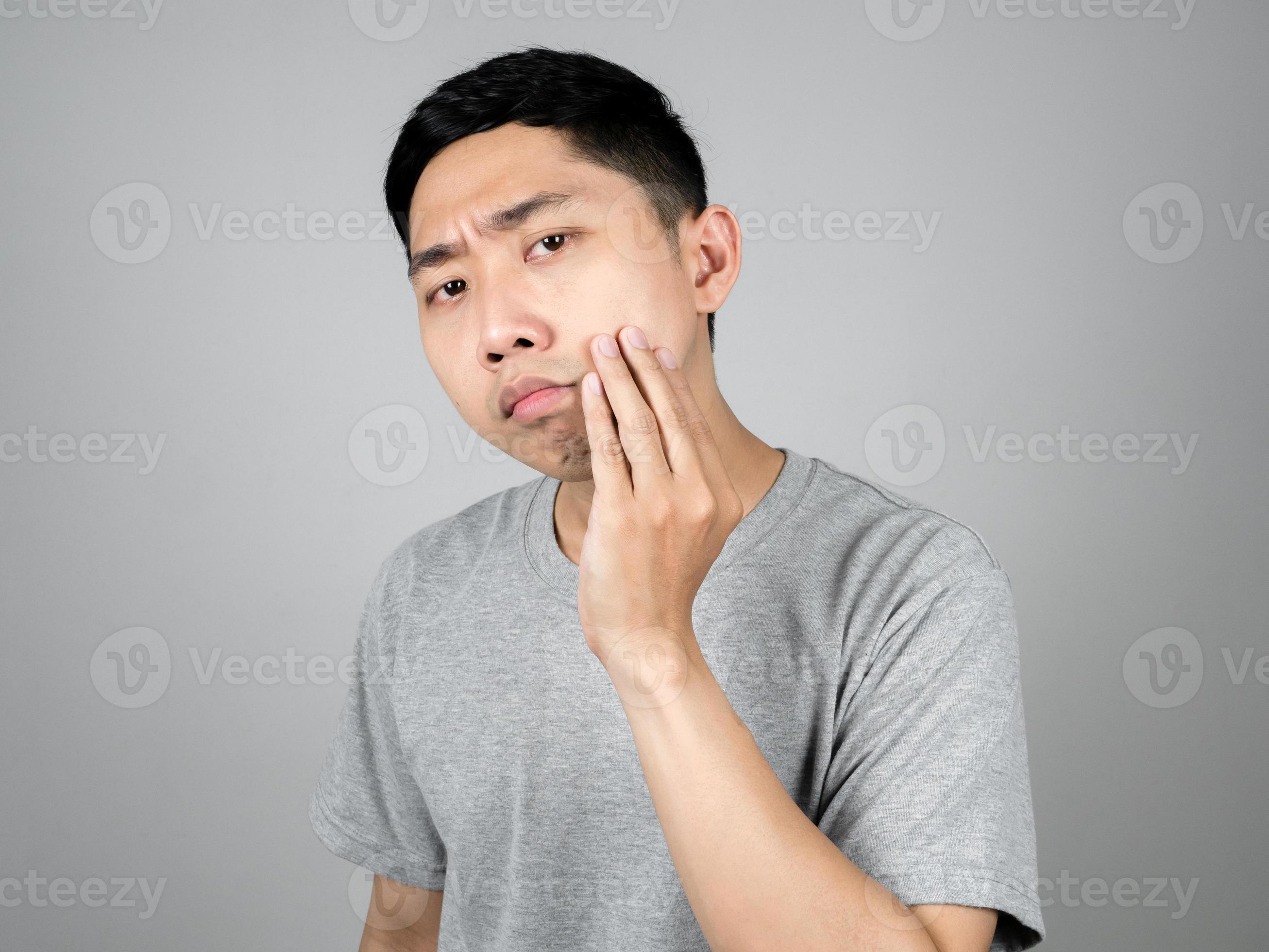 Close up asian man checking acne on his face feels worried isolated 17071657 Stock Photo at Vecteezy