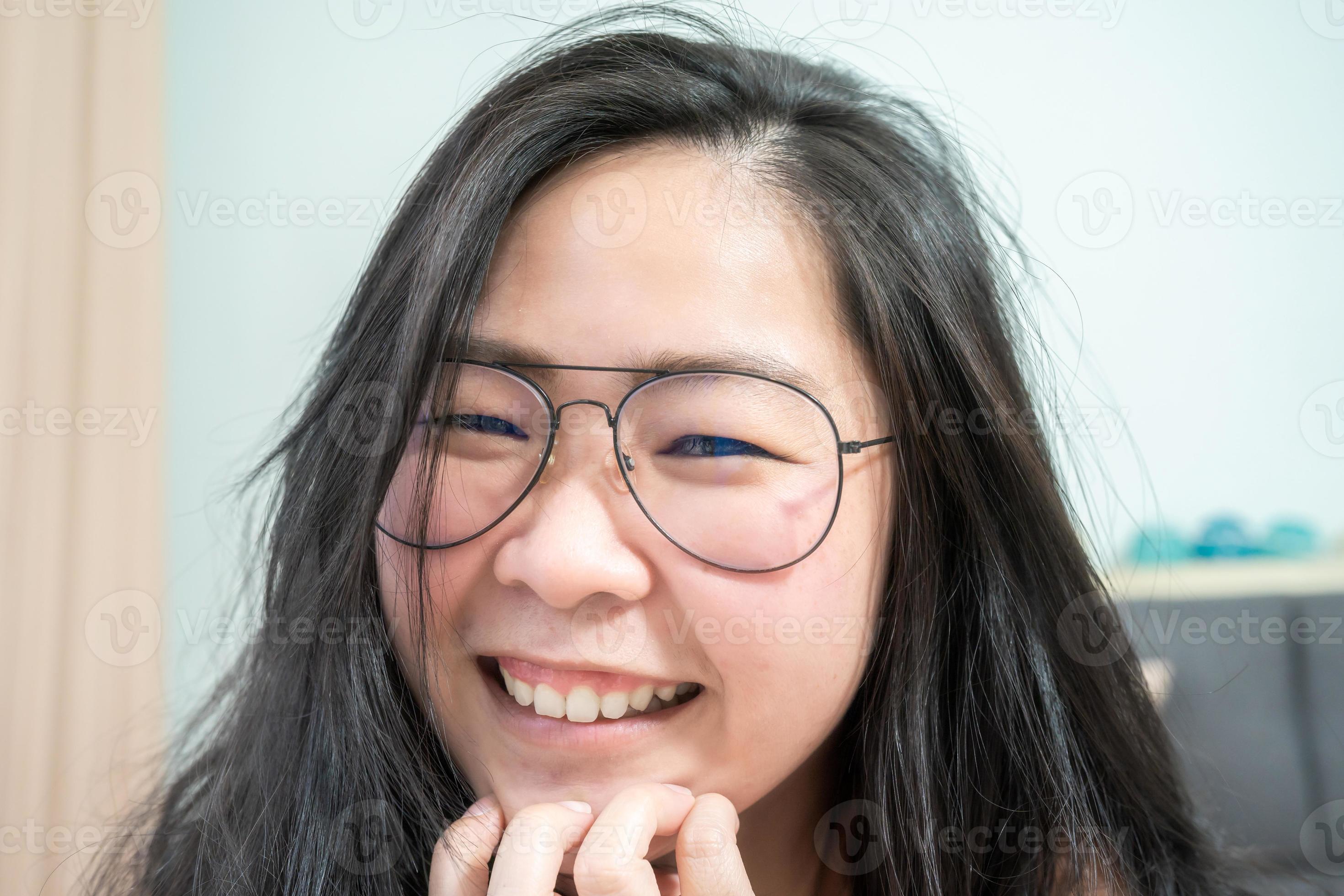 Close Up To Confident Young Asian Small Eye Woman Is Smiling In Her