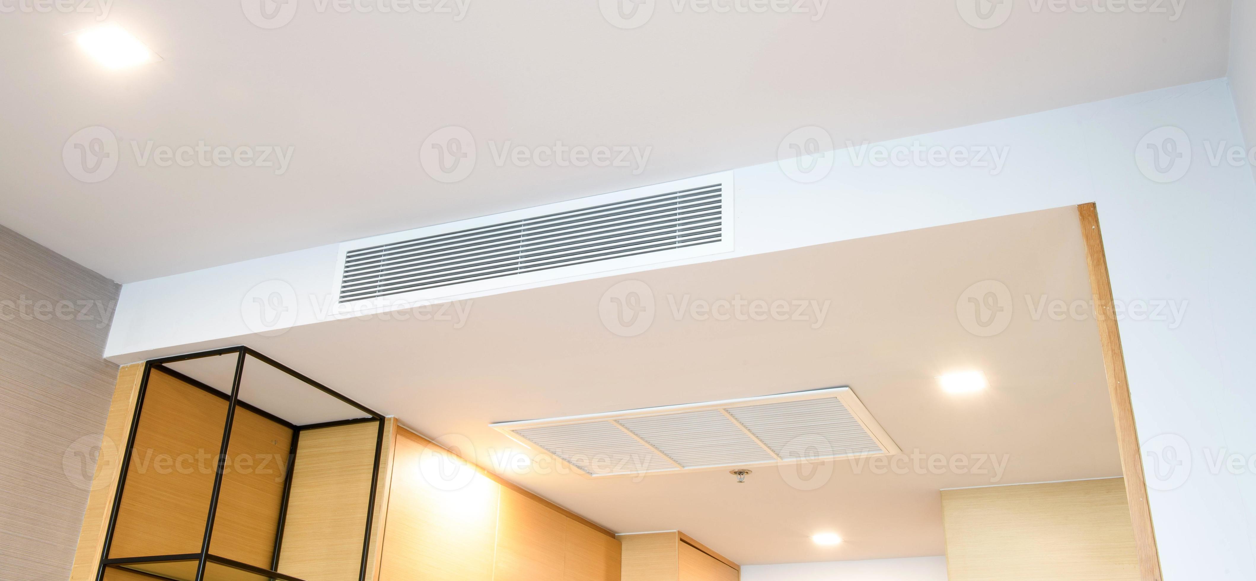 Ceiling mounted cassette type air conditioner and modern lamp light on ... Ceiling mounted cassette type air conditioner and modern lamp light on ...