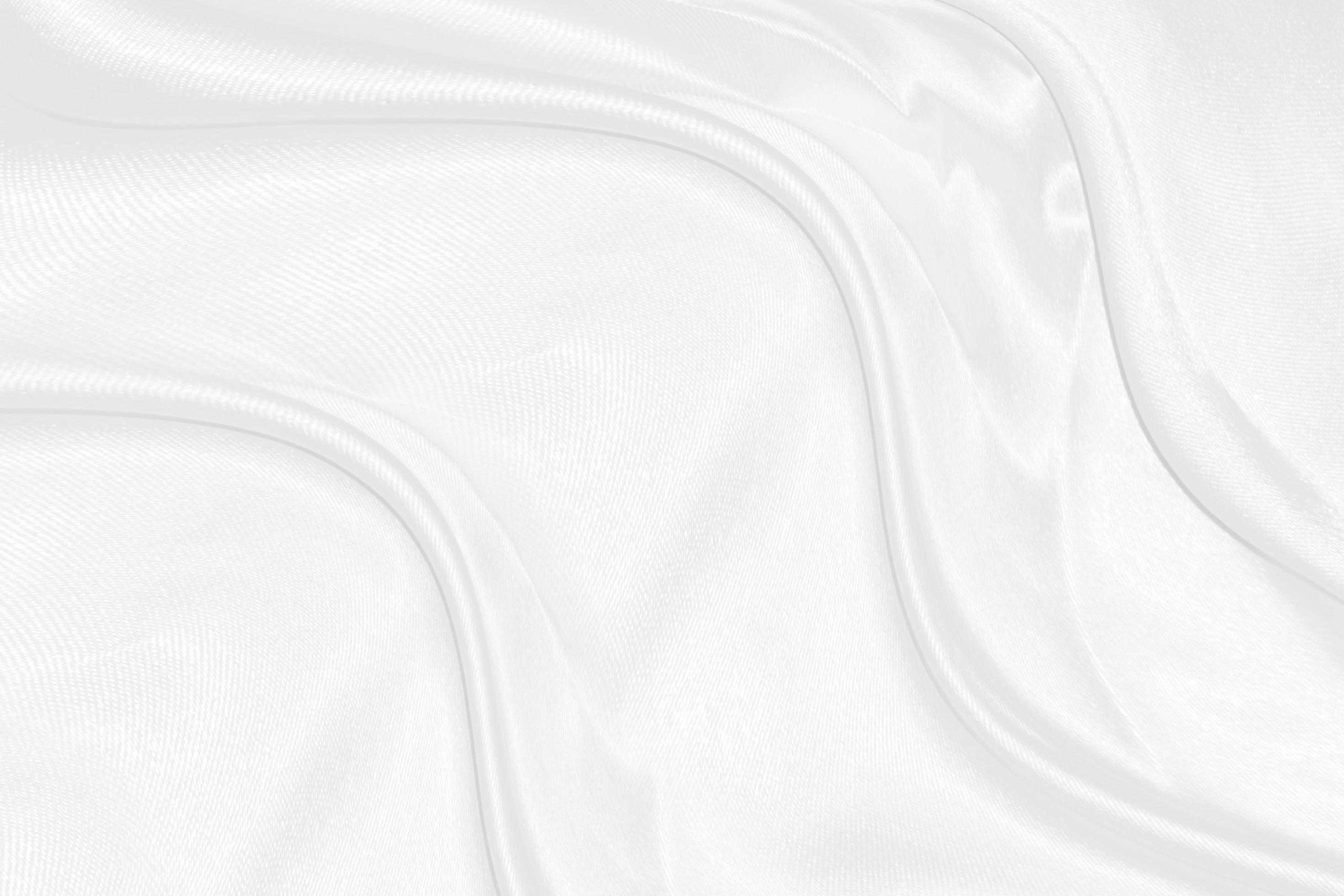 Smooth elegant white silk or satin luxury cloth texture can use as ...