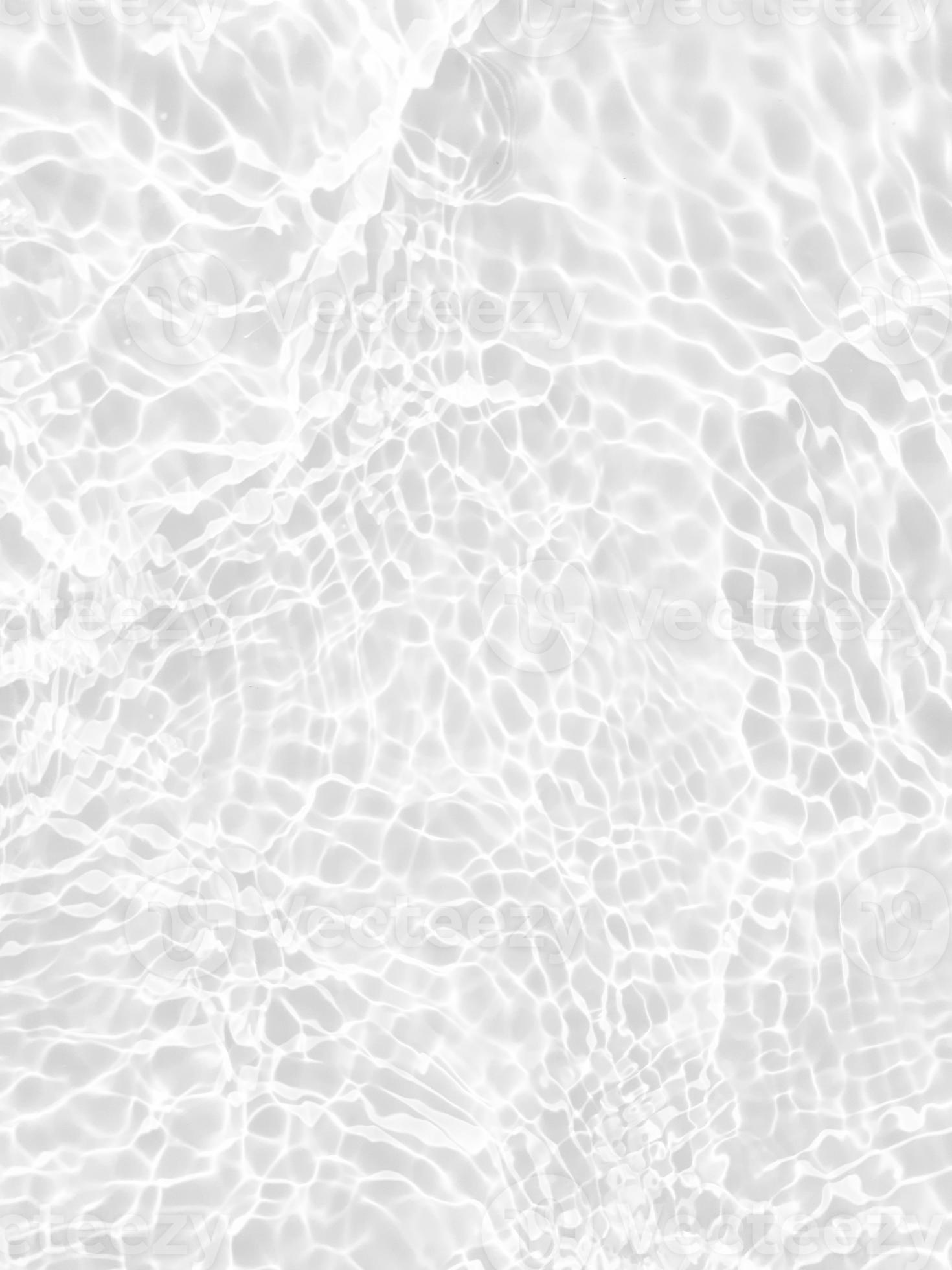 Defocus blurred transparent white colored clear calm water surface ...