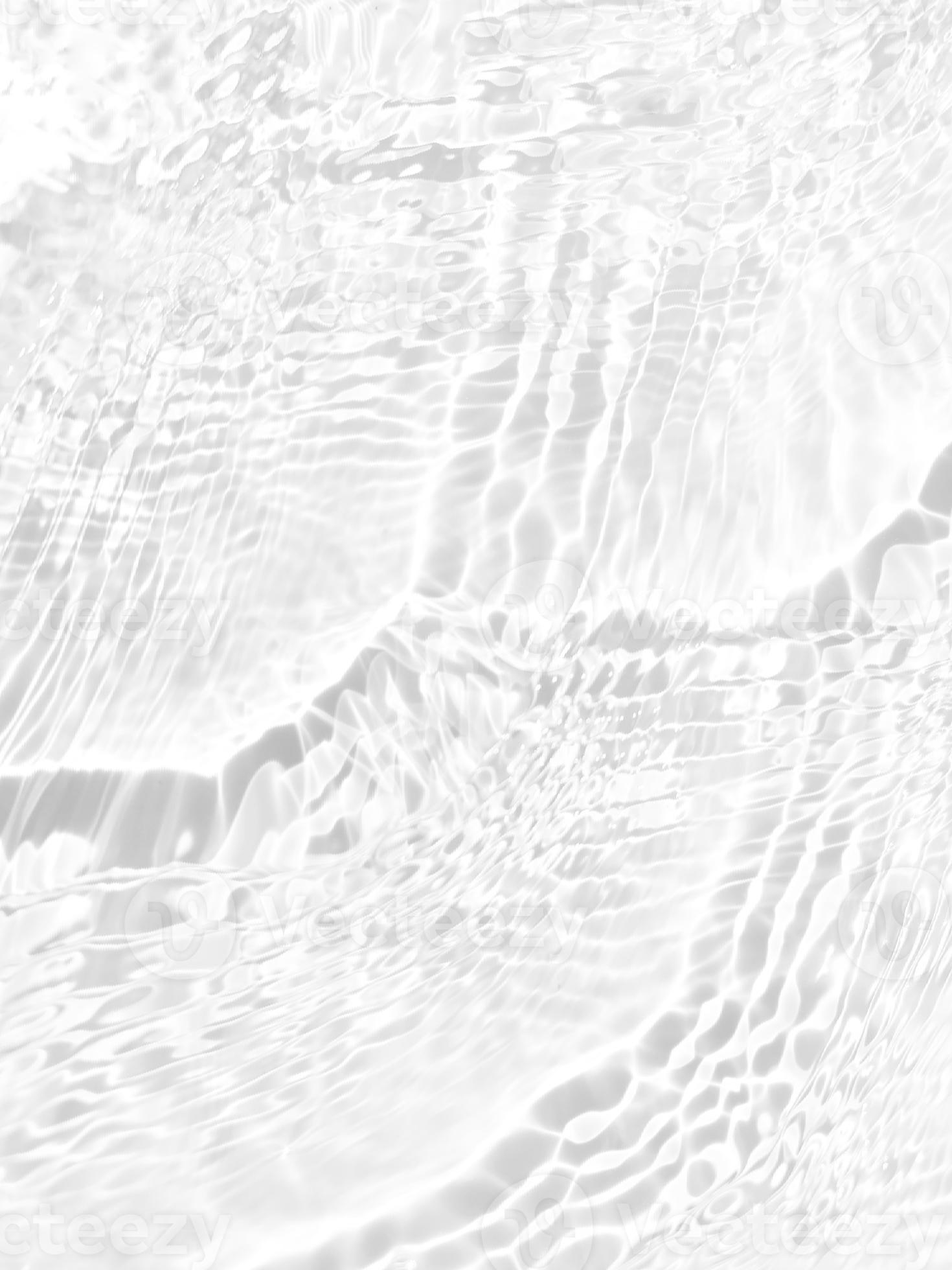 Defocus blurred transparent white colored clear calm water surface texture with splashes and ...