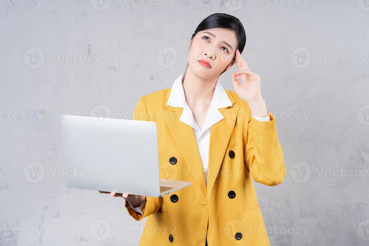 Photo of young Asian woman holding laptop 17562635 Stock Photo at Vecteezy Photo of young Asian woman holding laptop 17562635 Stock Photo at Vecteezy