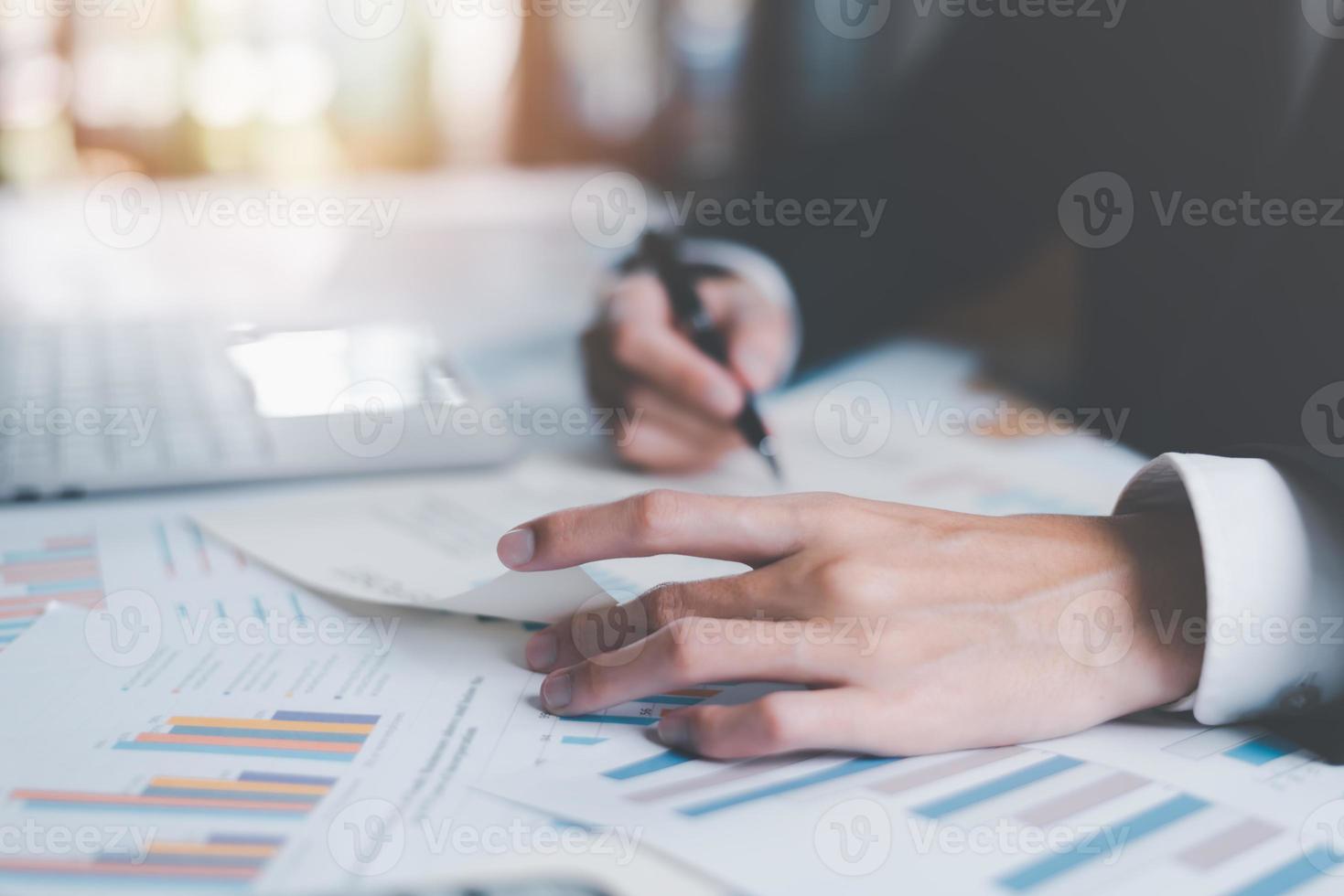 Business people read business statistics chart reports, to analyze and ... Business people read business statistics chart reports, to analyze and ...