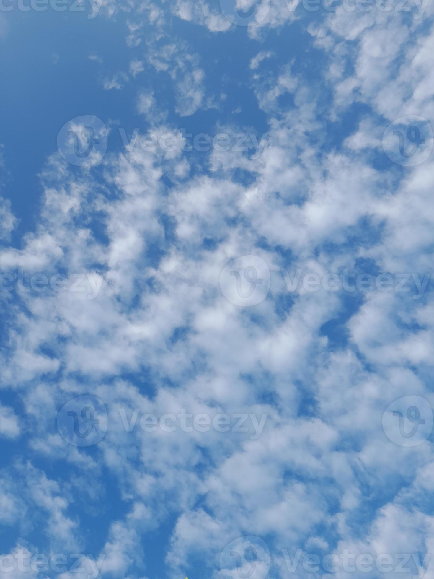 Beautiful white clouds on deep blue sky background. Elegant blue sky picture in daylight. Large ...