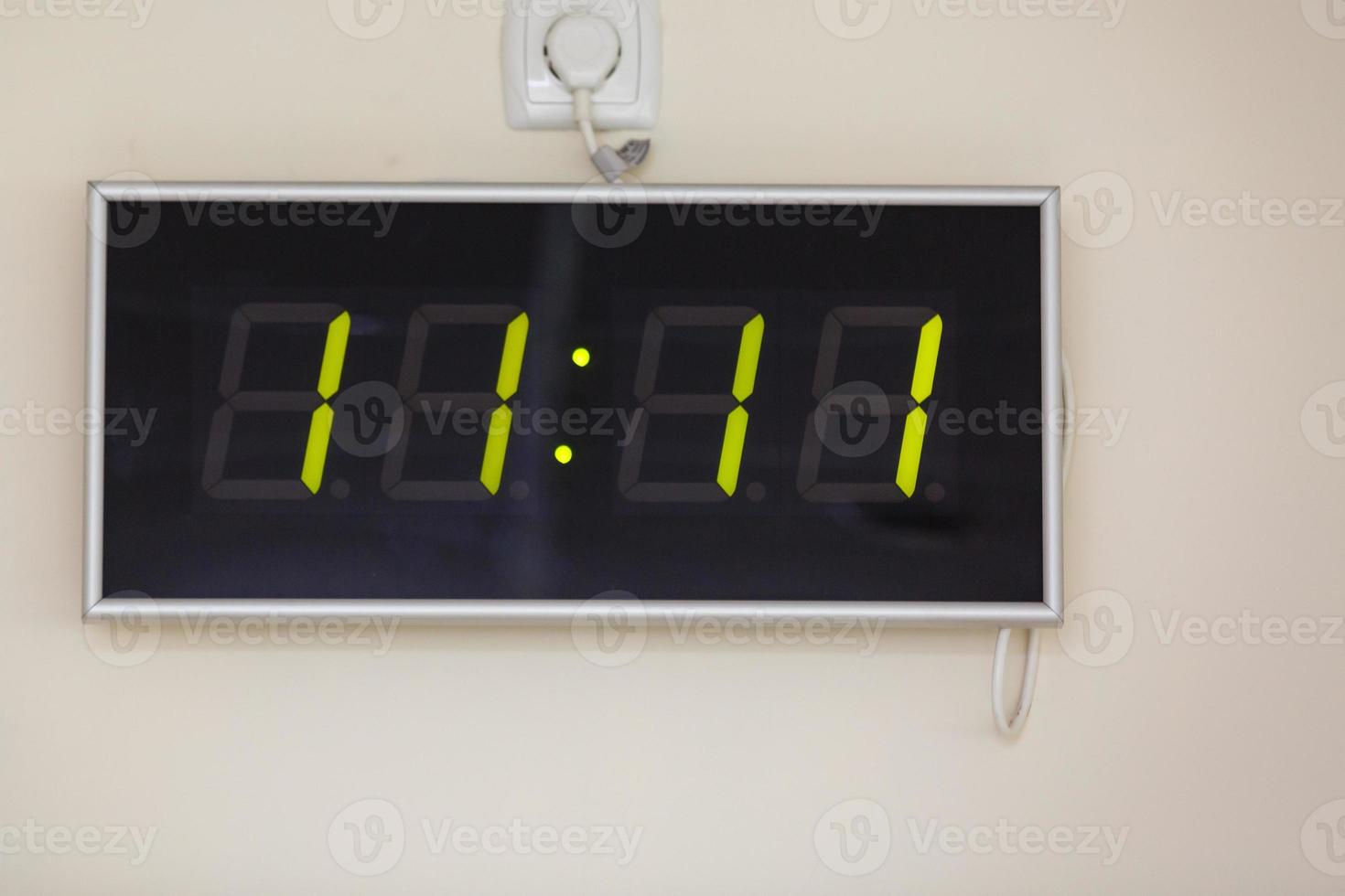 Black digital clock on a white background showing time eleven hours ... Black digital clock on a white background showing time eleven hours ...