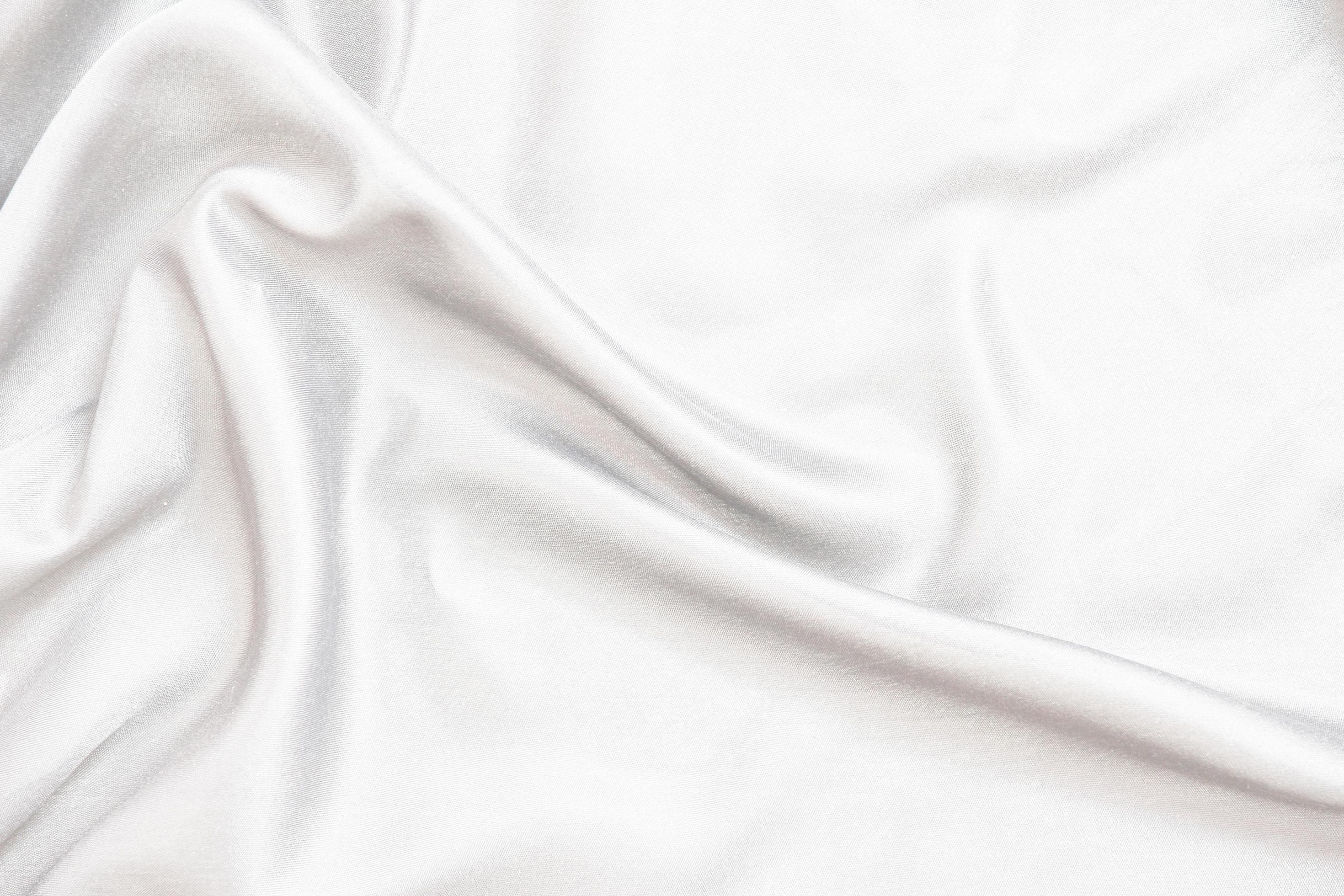 Smooth elegant white silk fabric or satin luxury cloth texture for ... Smooth elegant white silk fabric or satin luxury cloth texture for ...