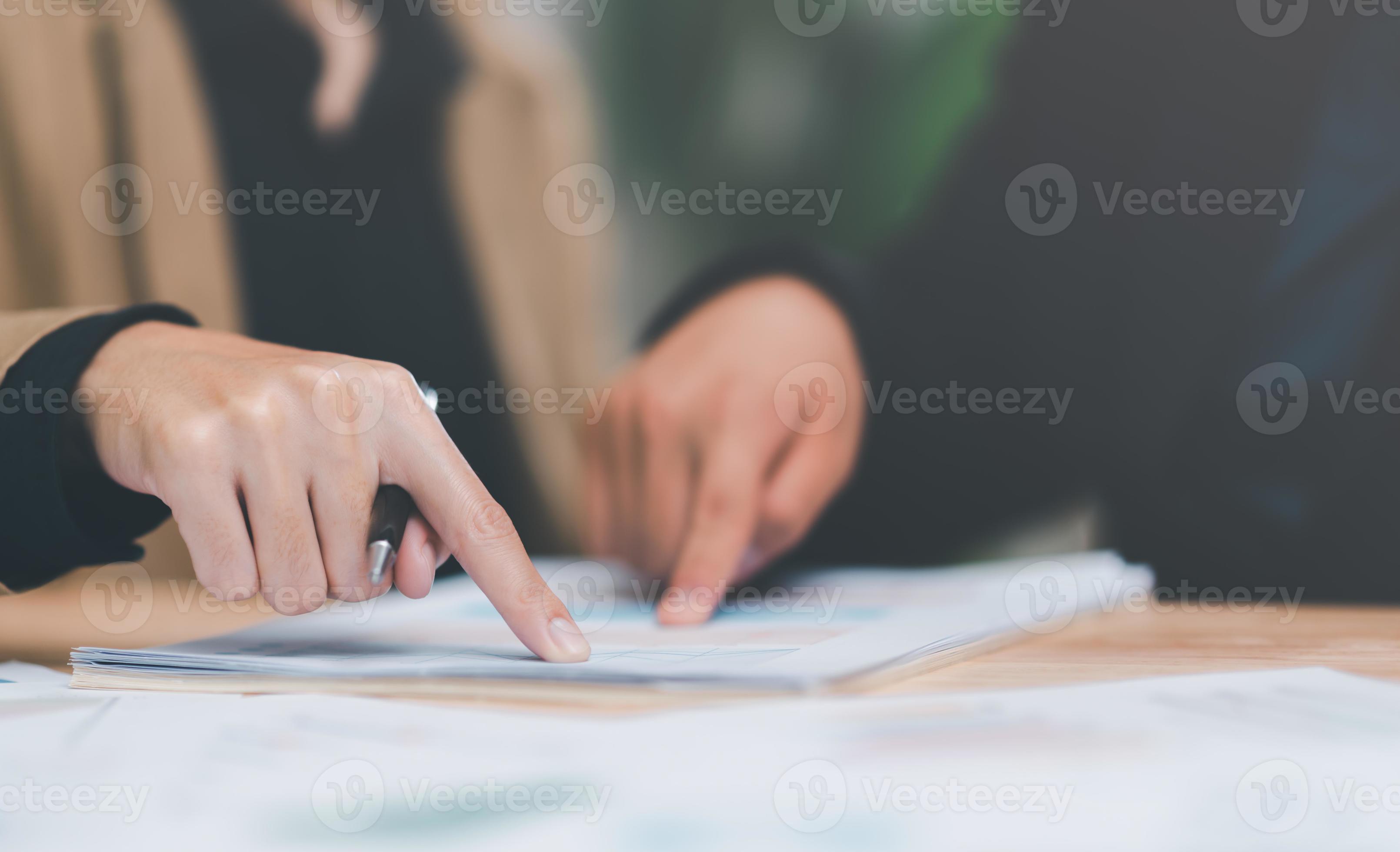 Business people read business statistics chart reports, to analyze and ... Business people read business statistics chart reports, to analyze and ...