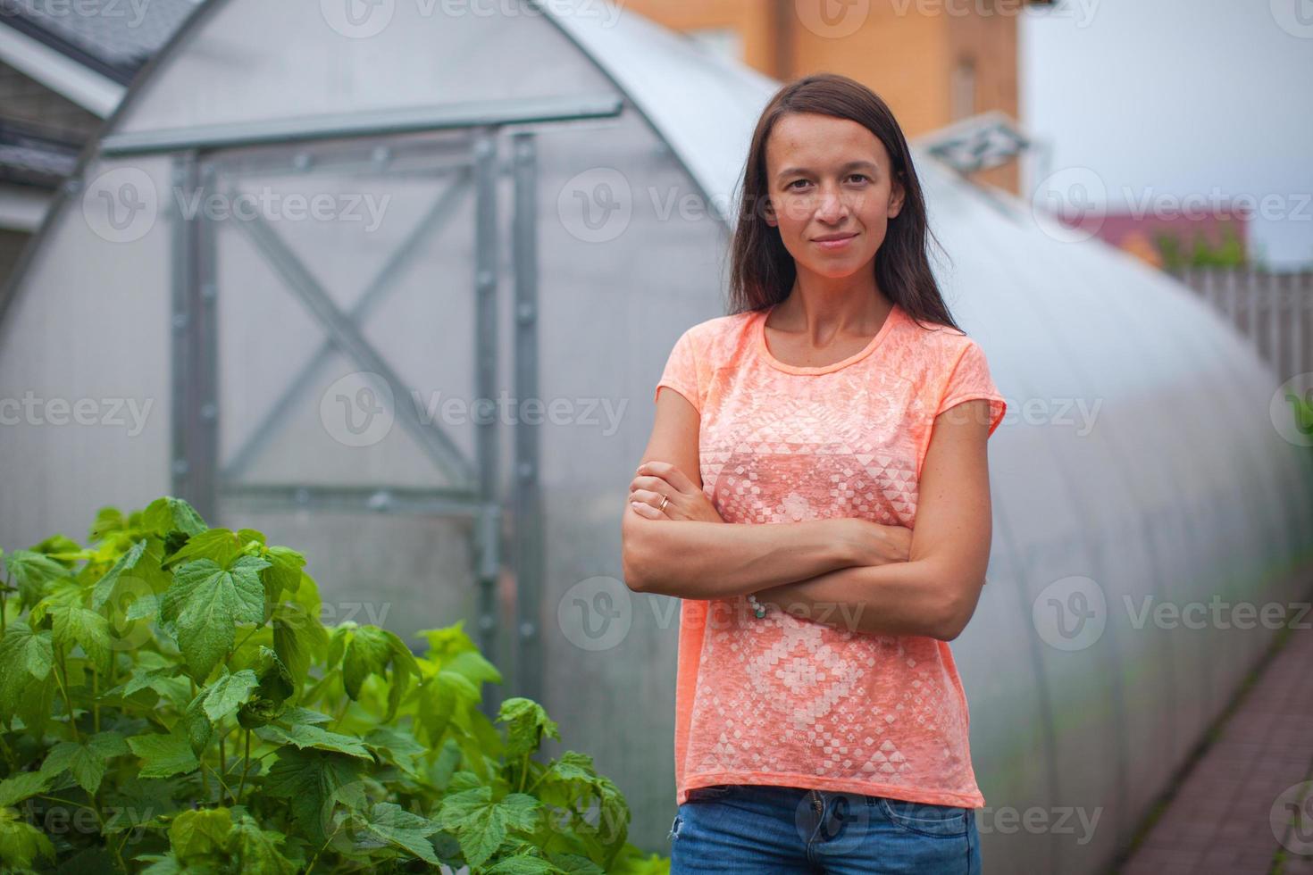 Young woman standing near her greenhouse 17700698 Stock Photo at Vecteezy Young woman standing near her greenhouse 17700698 Stock Photo at Vecteezy