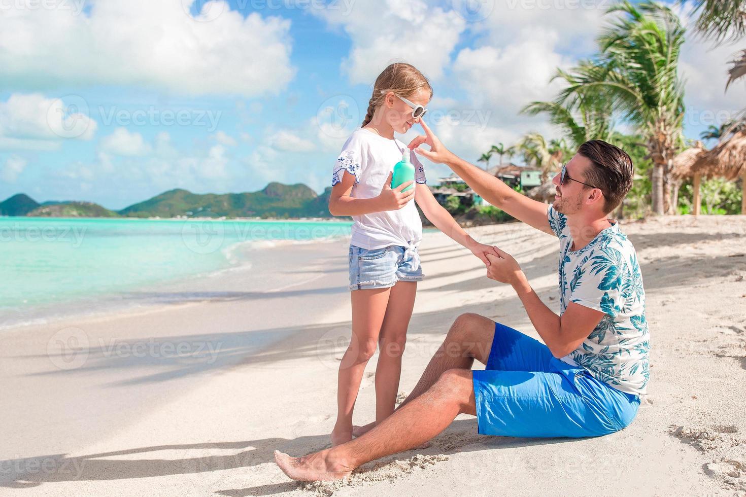 Young father applying sun cream to daughter nose on the beach. Sun protection 17760183 Stock ...