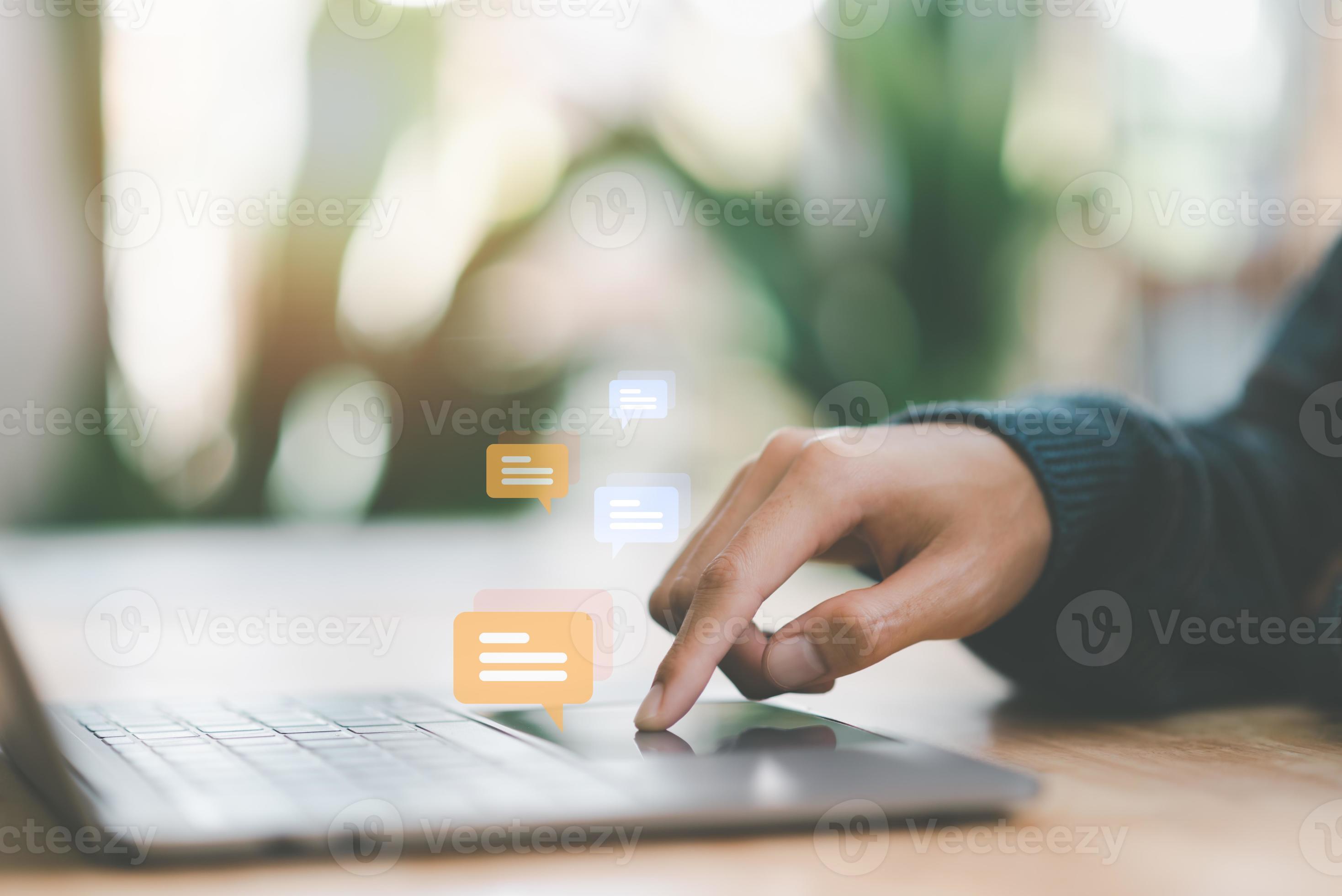 Human hand using a laptop computer,Conversation in the chat box icon ...