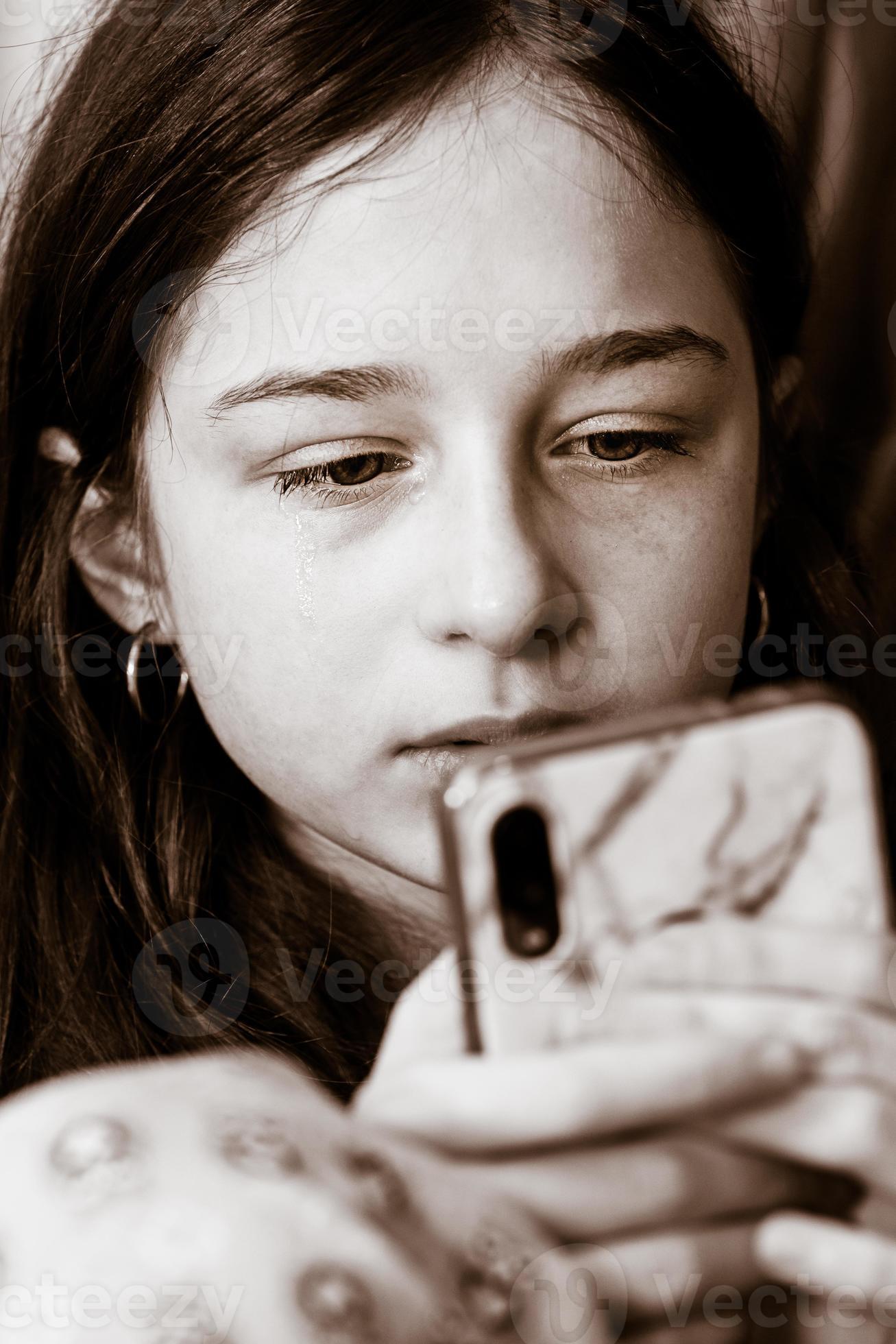 Teenage girl shoulder looking into smartphone. Black and white photos ...