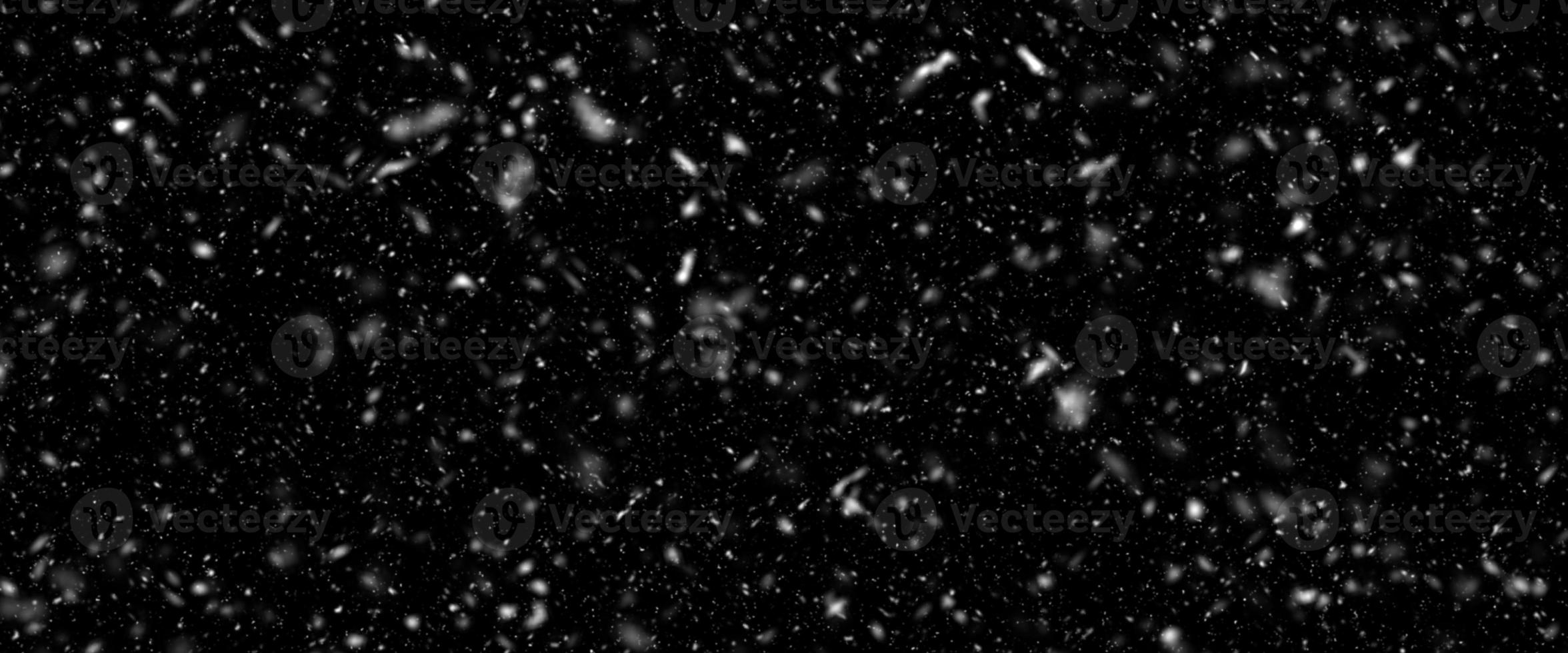 Falling snow flakes, Flying dust particles on a black background. Abstract winter background ...