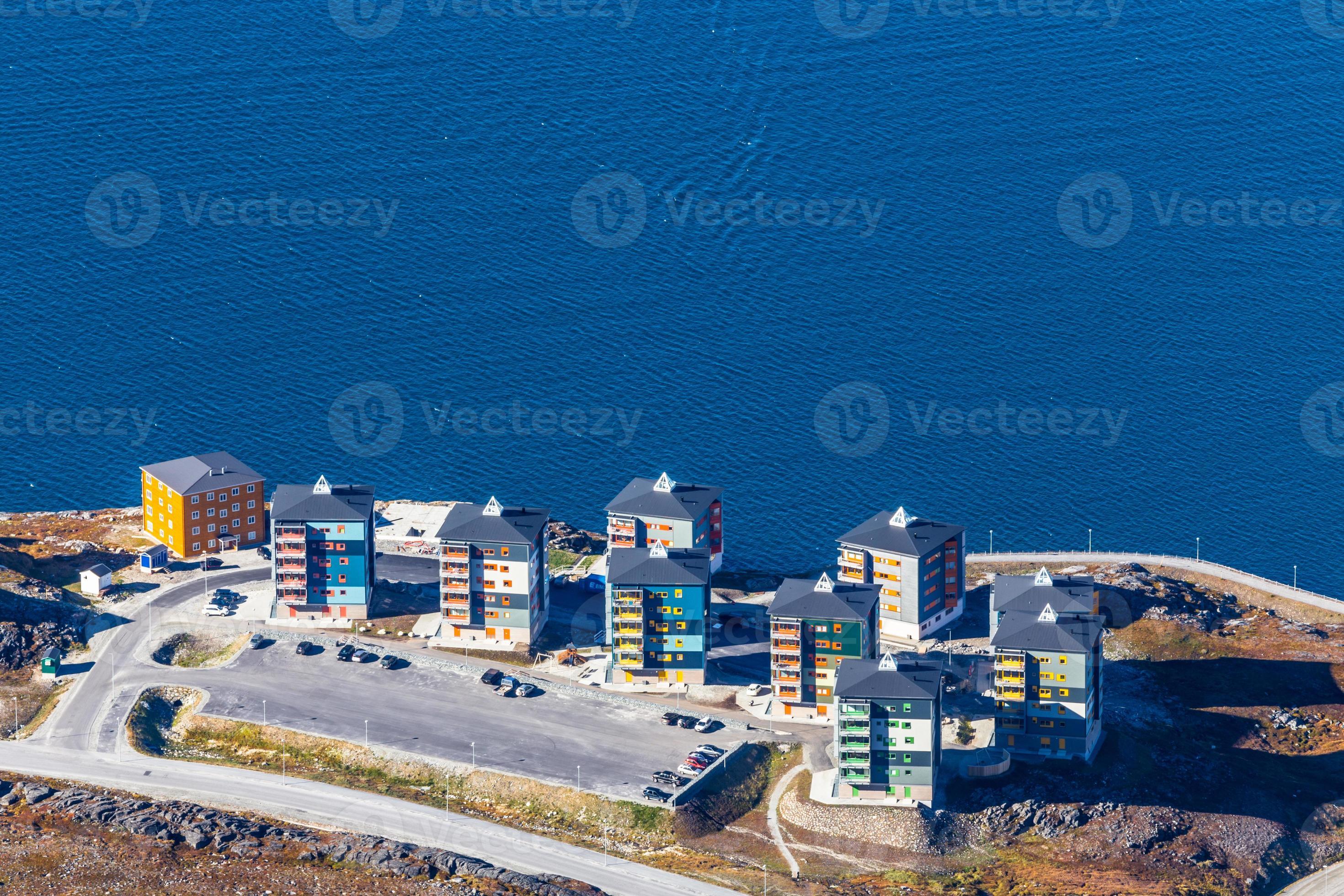 Aerial view of Nuuk city with modern streets and buildings at the fjord ...