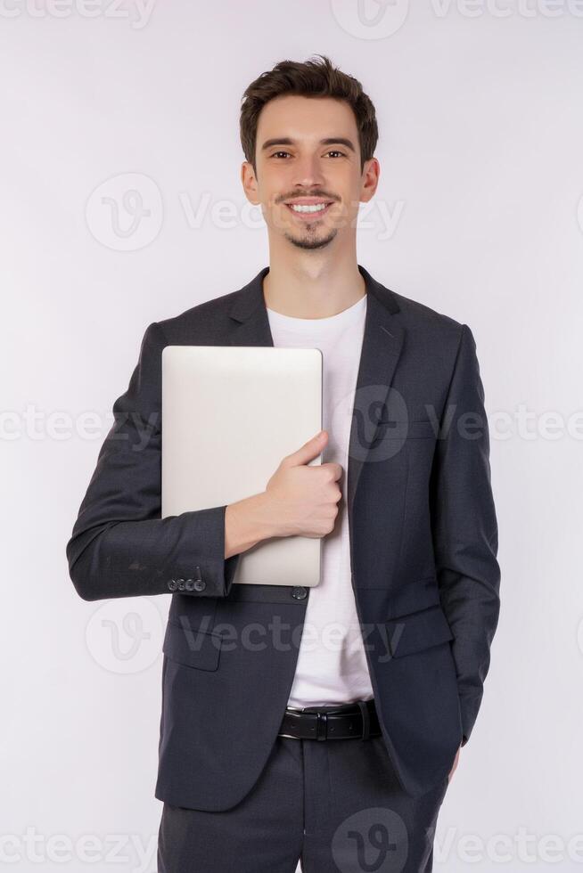 Portrait of young businessman happy positive smile holding laptop ...