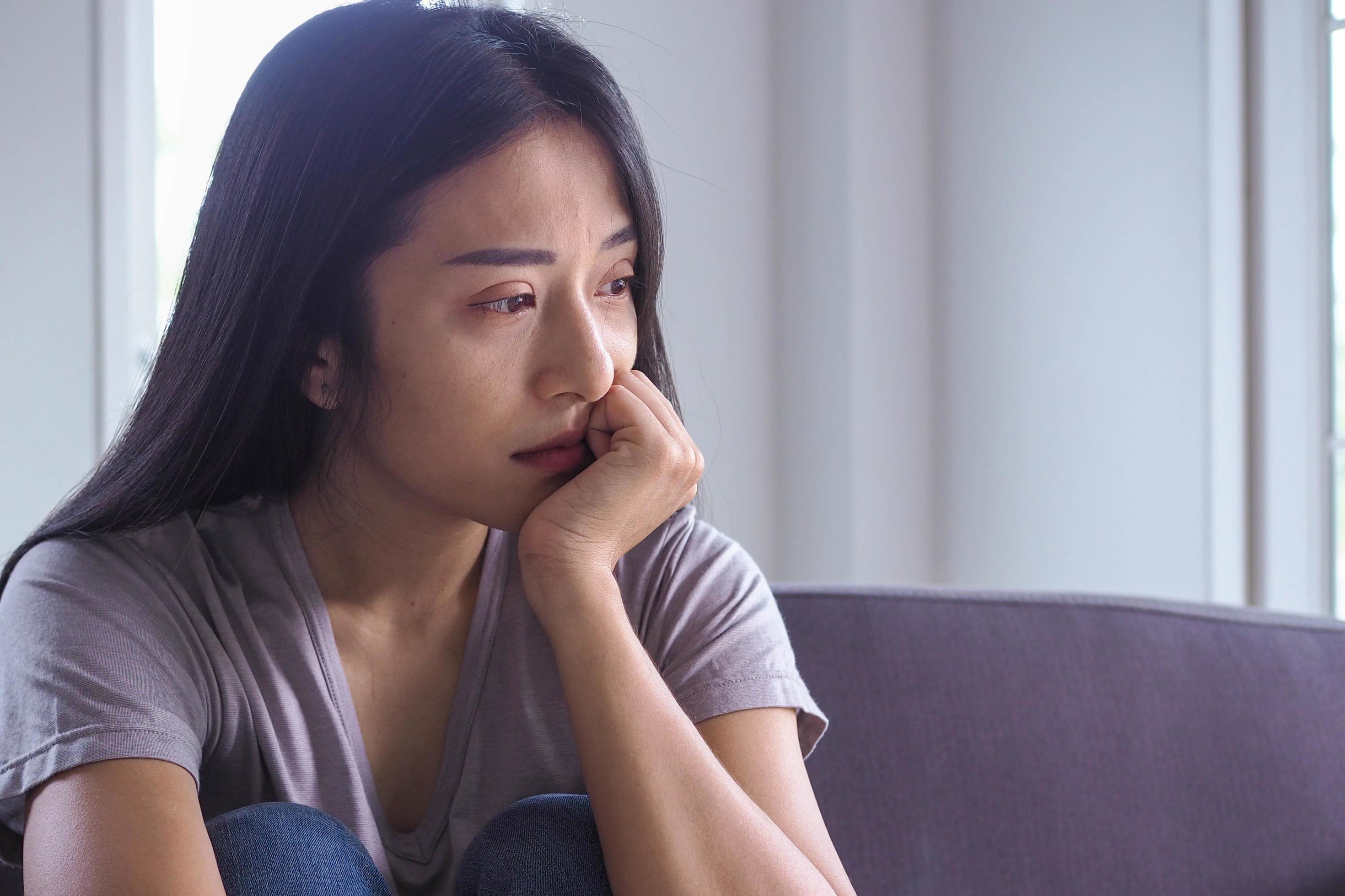 Asian girl sitting alone in the house. Depression concept 18974197 Stock Photo at Vecteezy