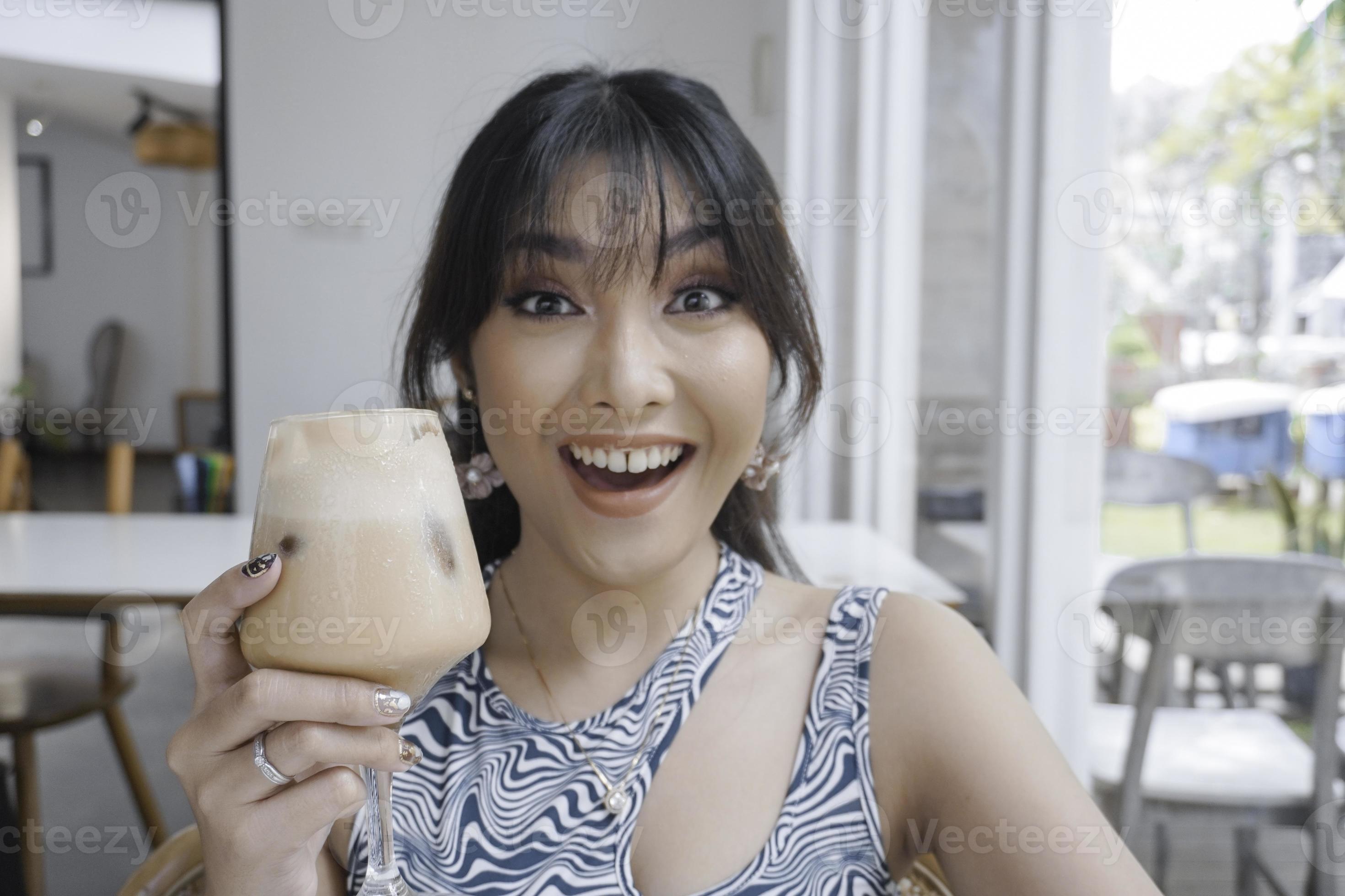Close Up Girl Is Drinking Coffee She Has Coffee Foam On Her Lips And She Smiles She Is