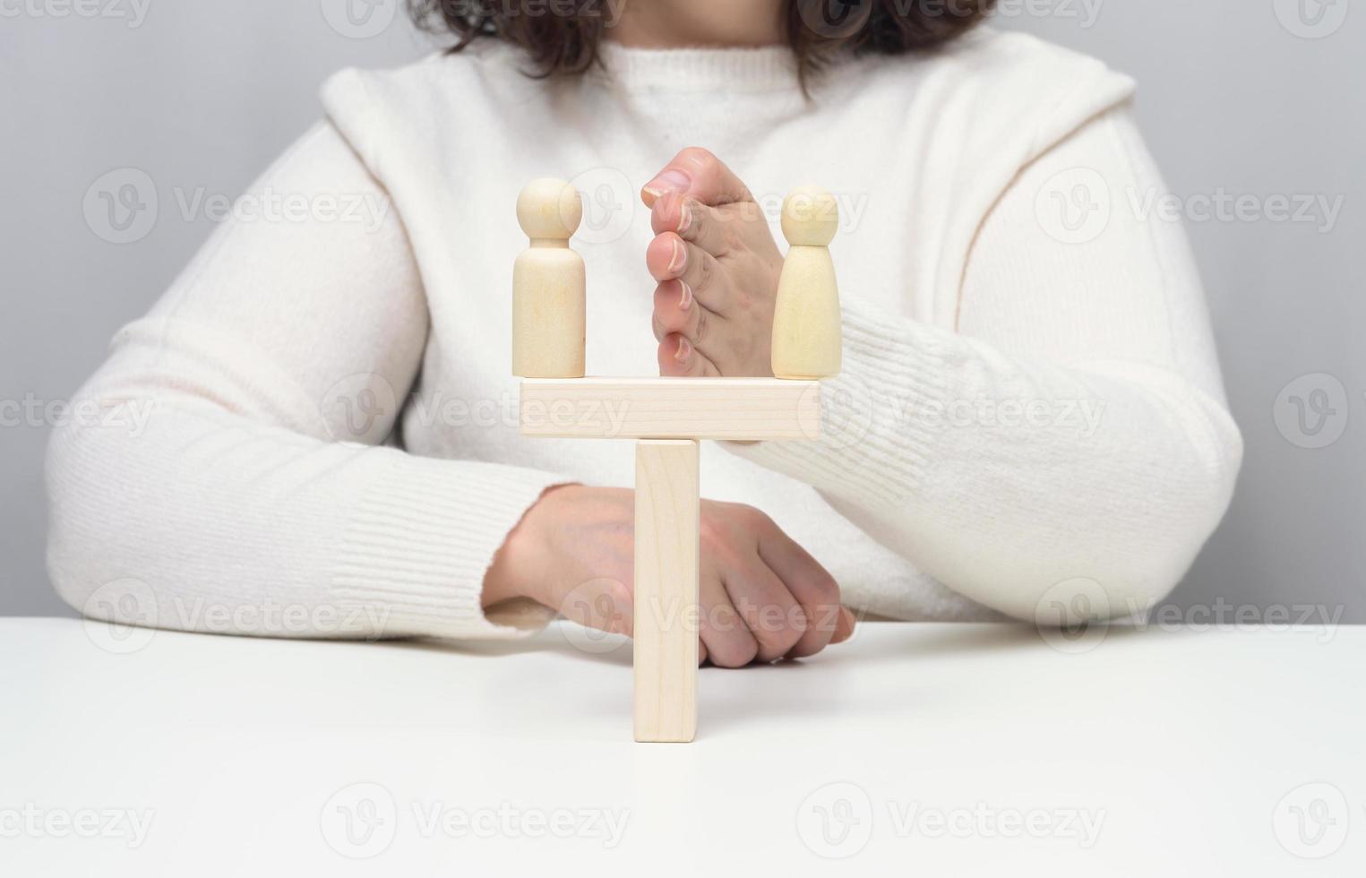 two wooden figurines of a man stand opposite each other 19034693 Stock ... two wooden figurines of a man stand opposite each other 19034693 Stock ...