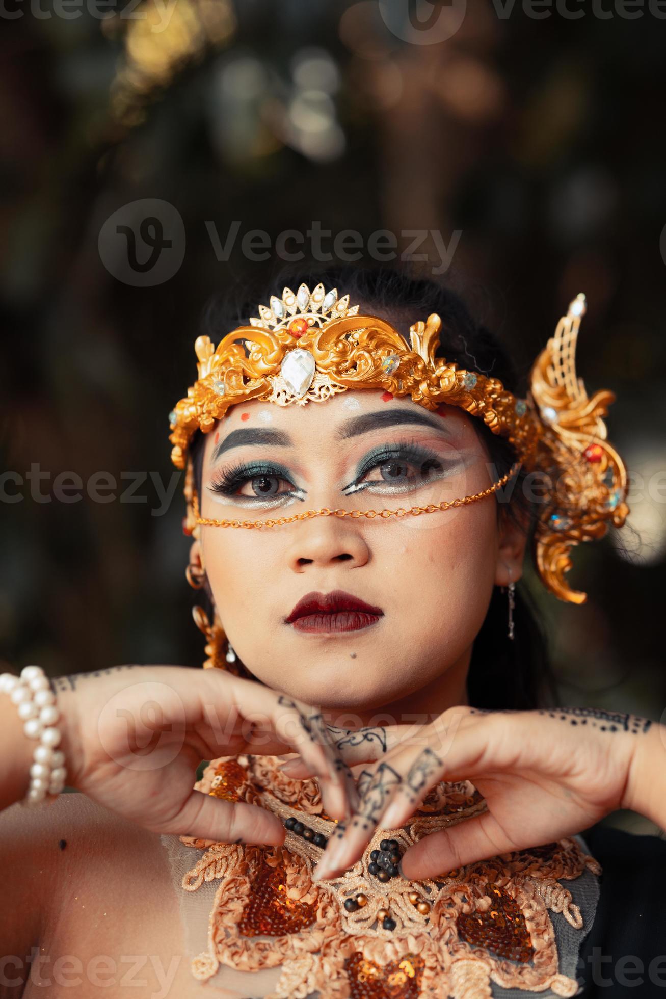 Portrait Of An Indian Woman In Makeup And Tattoos On Her Hands While