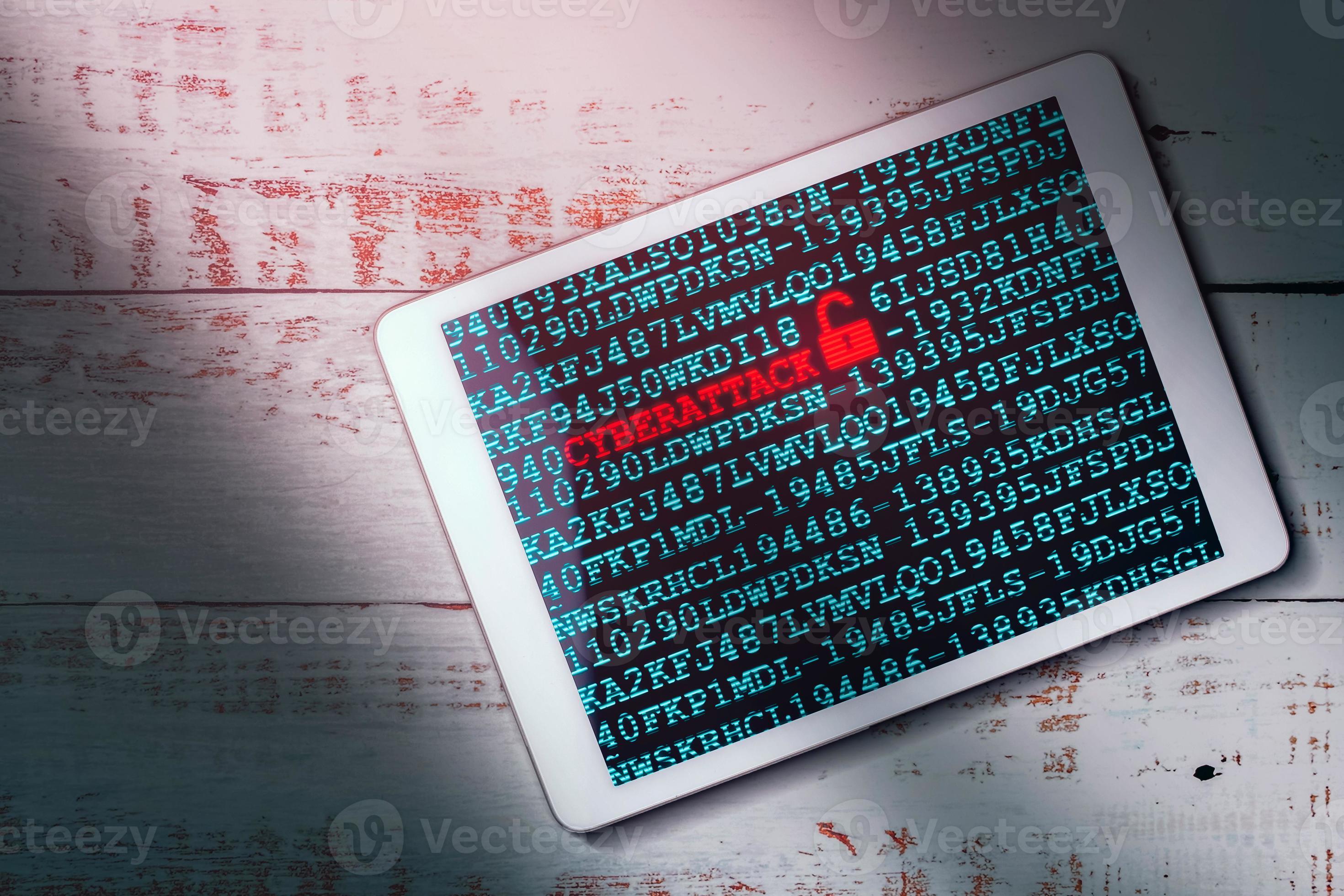 Top view of digital tablet with cyber attack warning on screen. Cyber security concept. Future ...