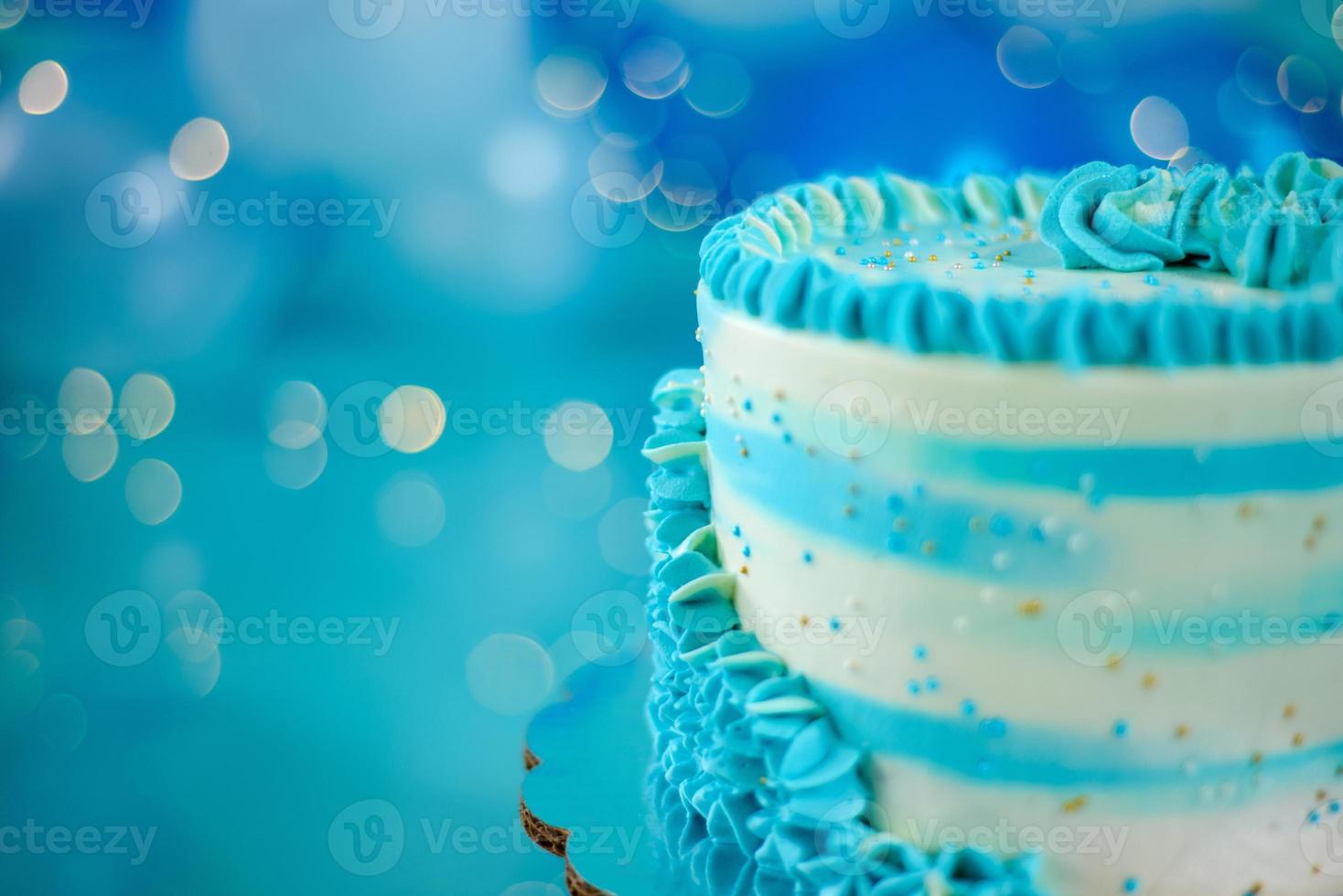 Blue And White Birthday Cake With Balloons In The Background 19866192 blue-and-white-birthday-cake-with-balloons-in-the-background-19866192