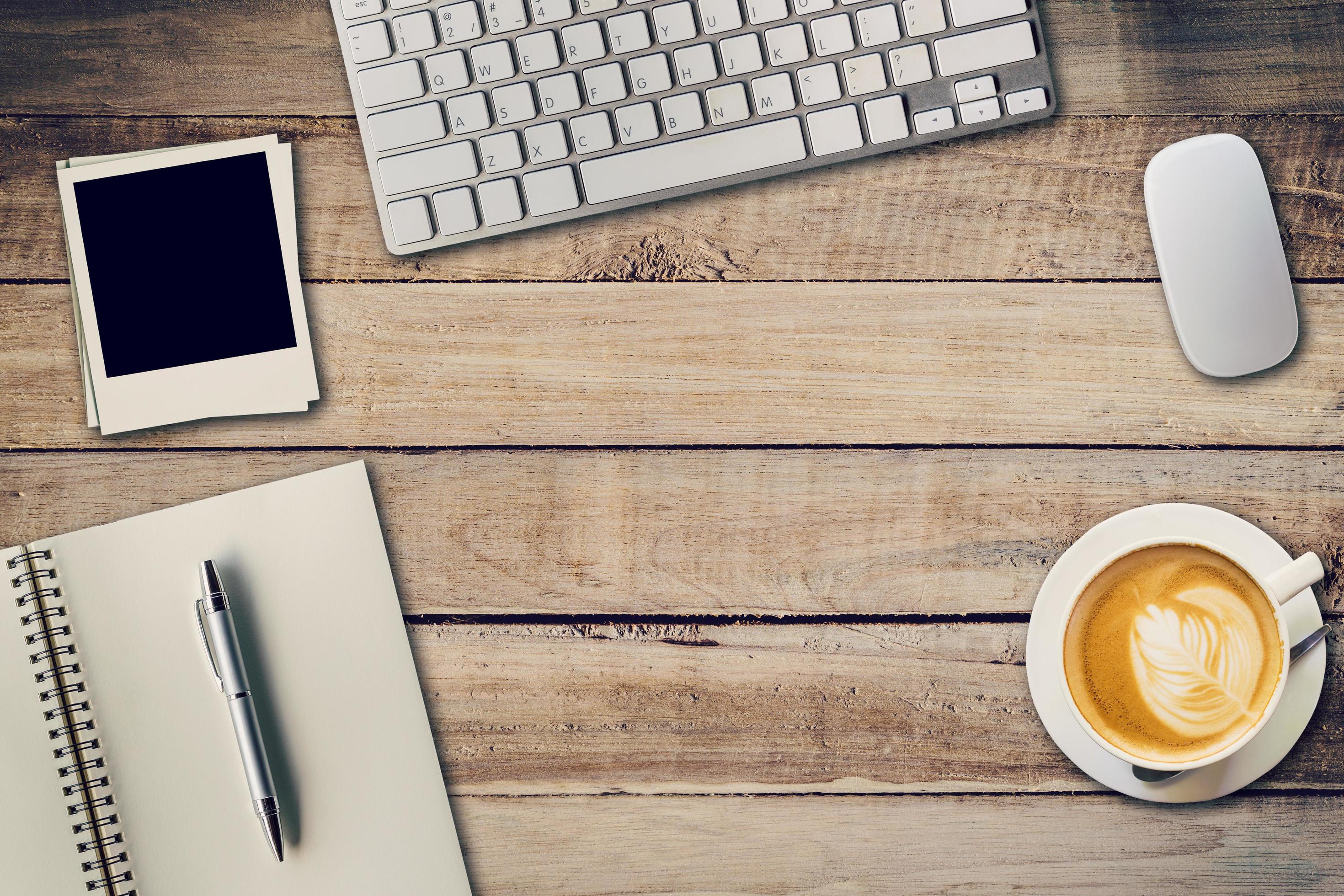 Top view office table with notepad, computer and coffee cup and ...
