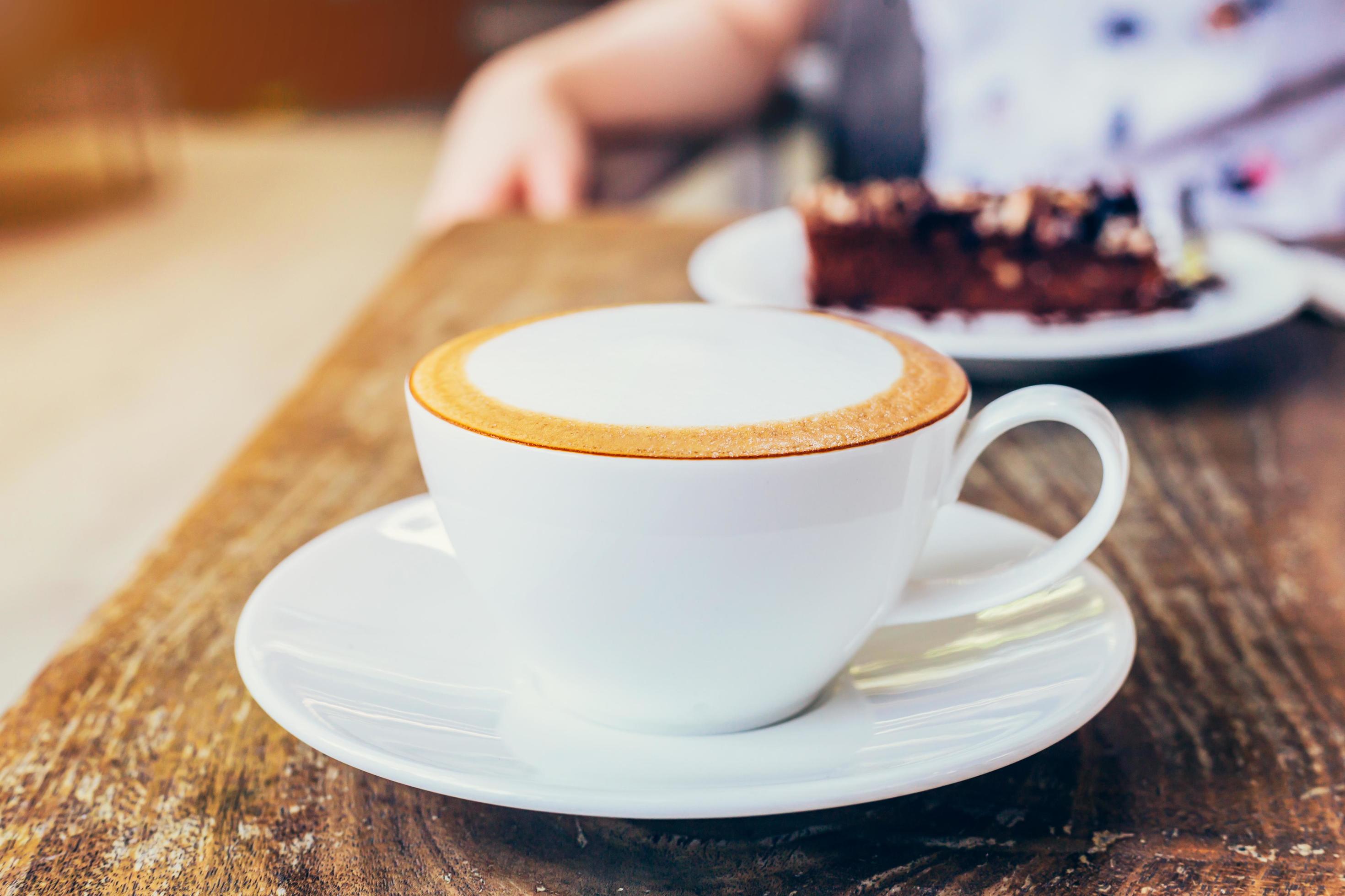 close-up-coffee-on-wood-table-in-coffee-shop-cafe-19925153-stock-photo