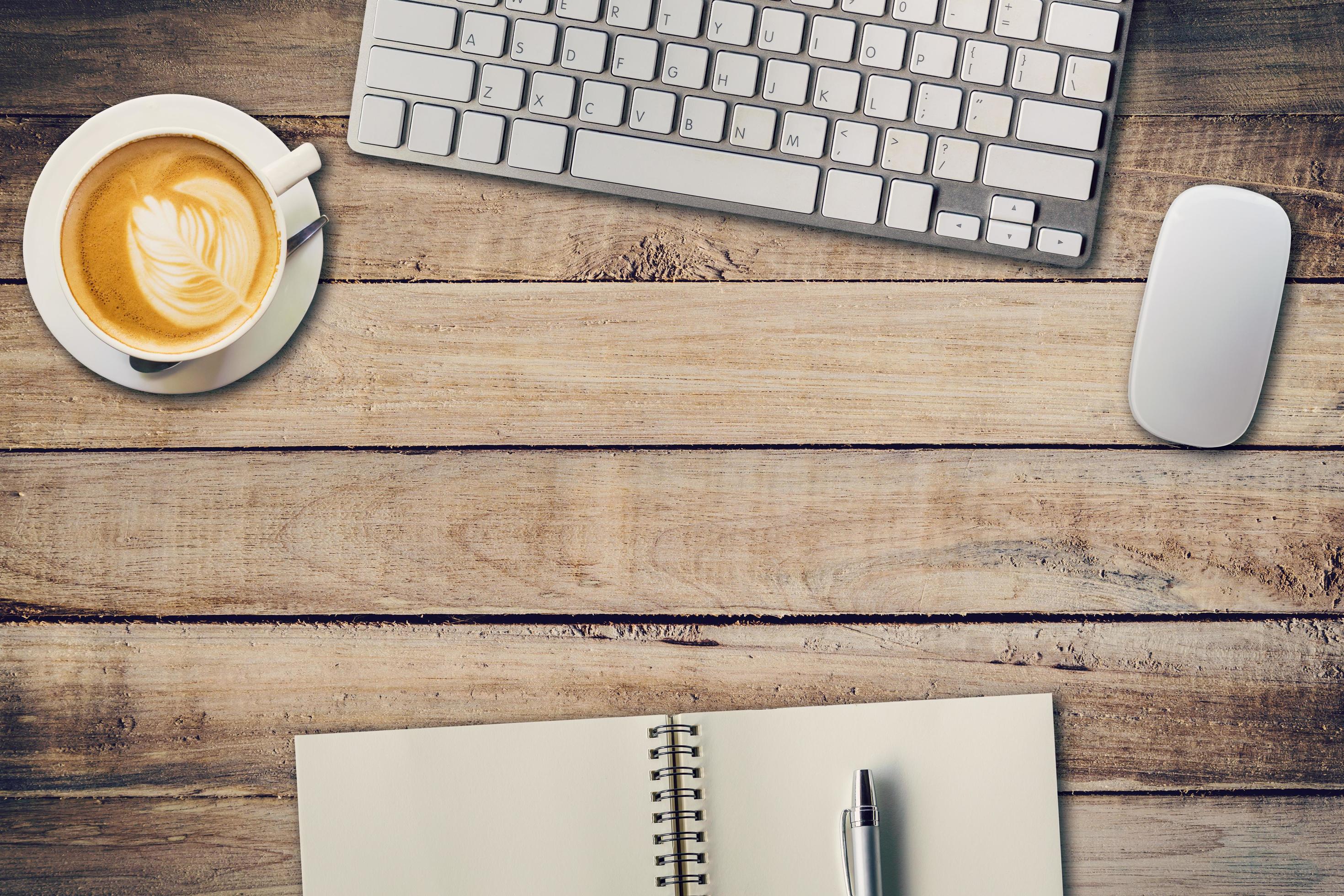 Top view office table with notepad, computer and coffee cup and ...