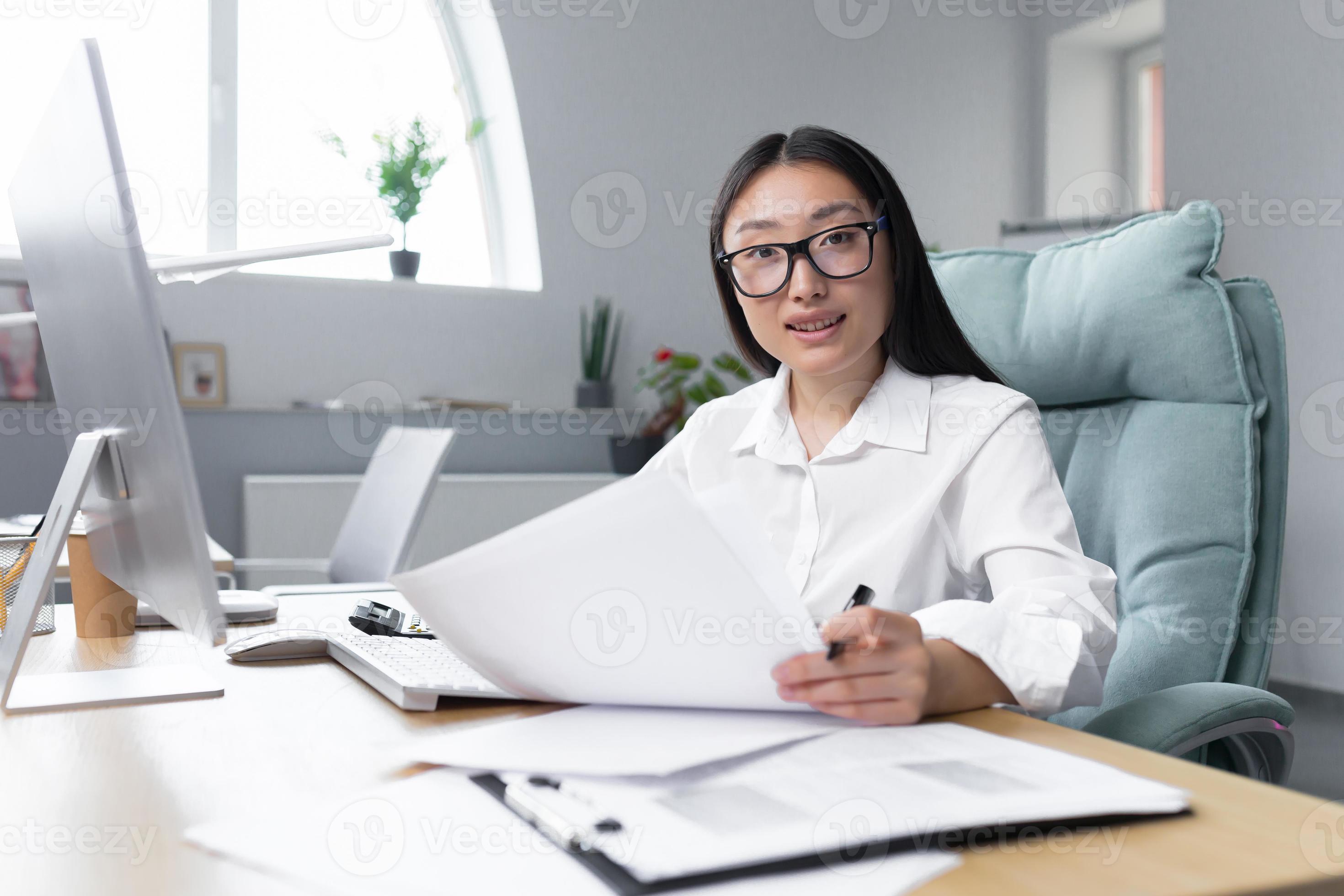 Portrait Of Young Successful Asian Financier Businesswoman Working In