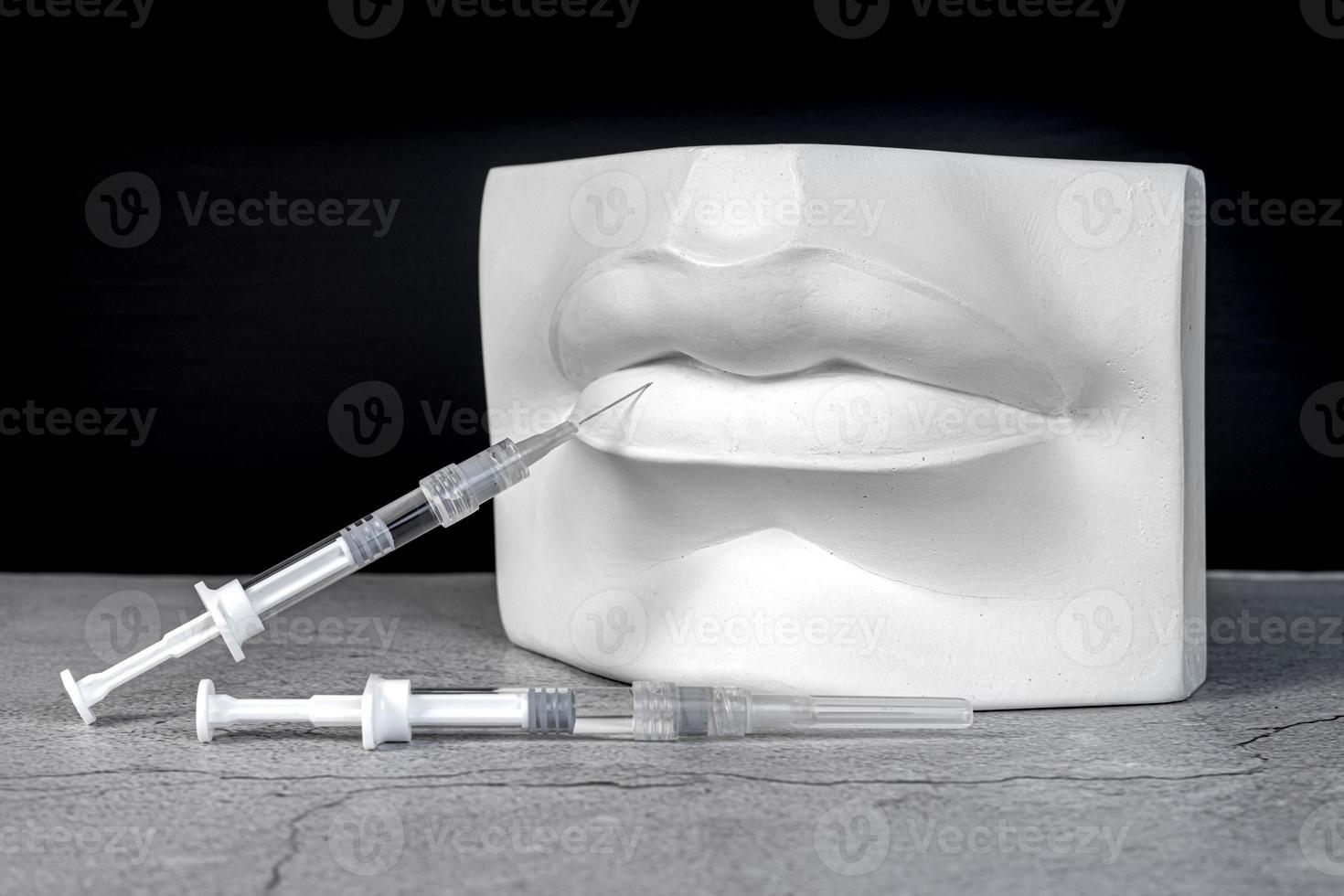 Injections. Antique plaster lips with medical syringes. Beauty and lip ... Injections. Antique plaster lips with medical syringes. Beauty and lip ...