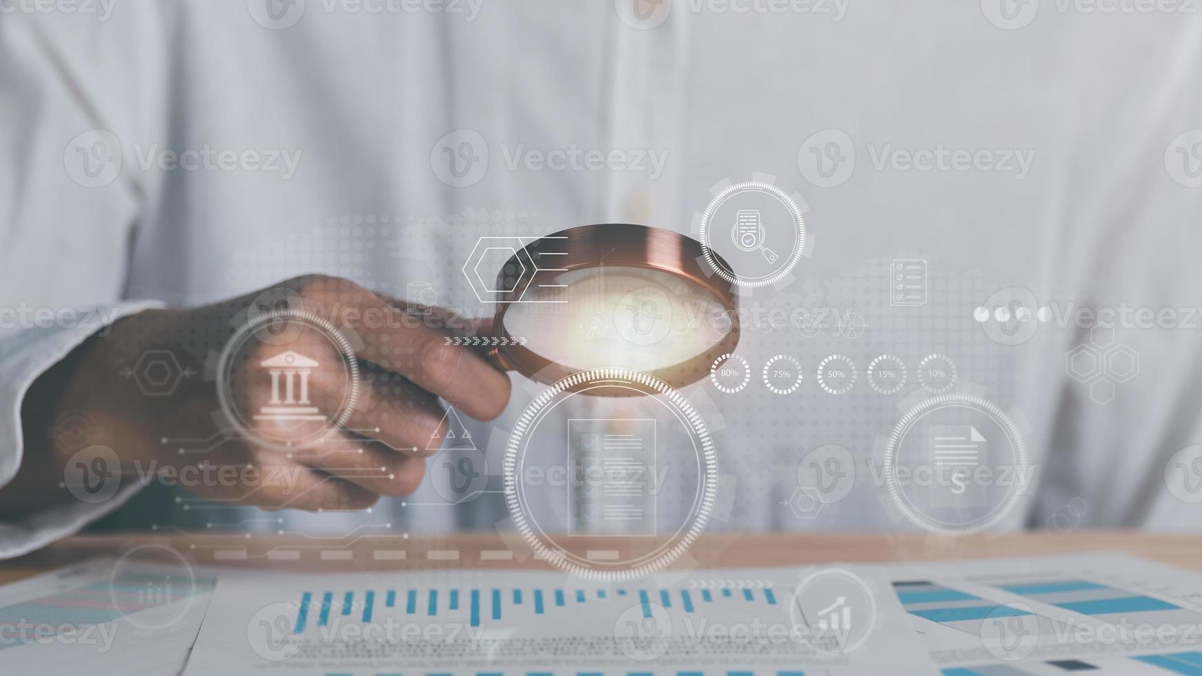 Businessman holding a magnifying glass,Audit Document Concepts, quality ... Businessman holding a magnifying glass,Audit Document Concepts, quality ...