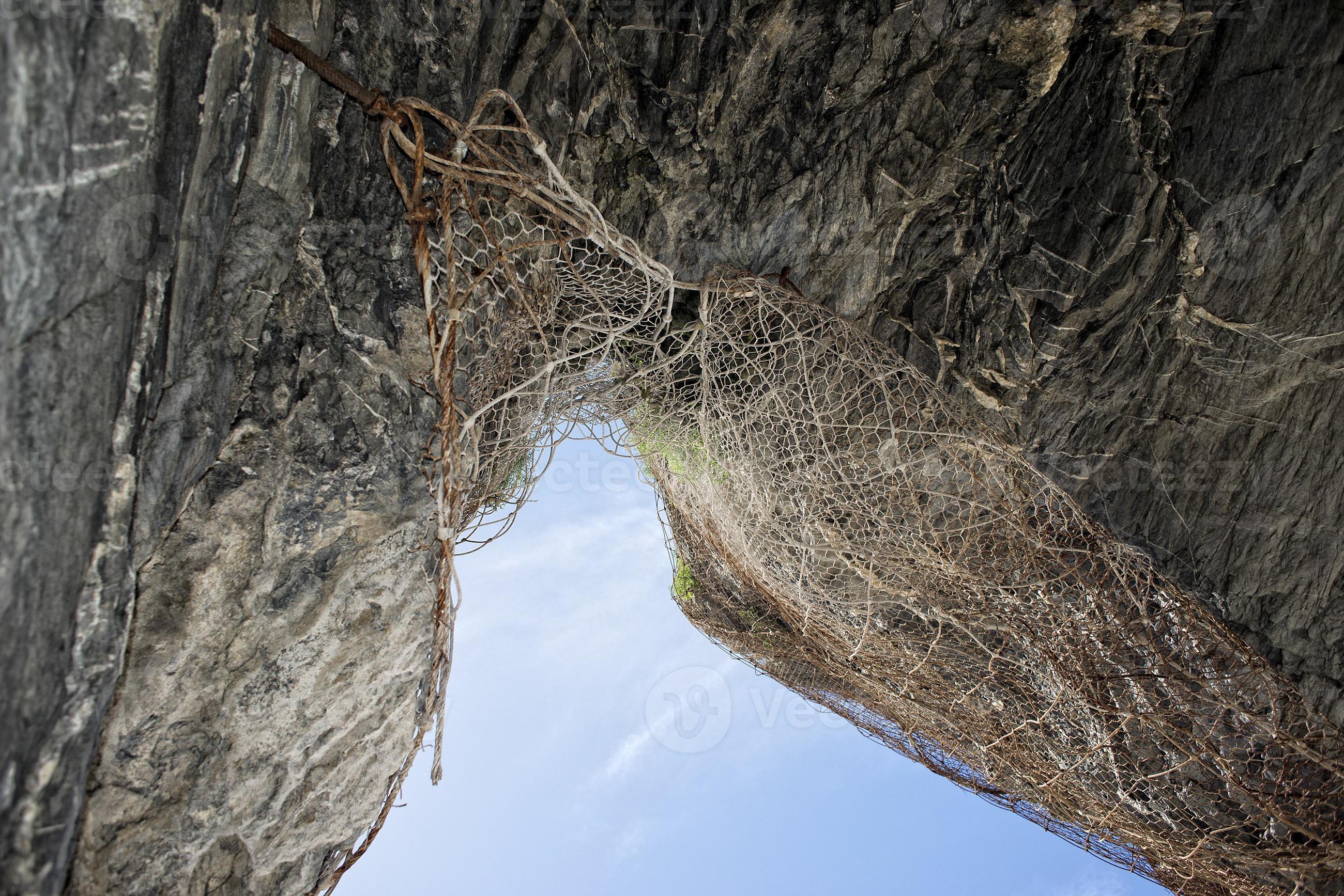 Metallic grid on rocks to prevent collapse in Cinque terre village ... Metallic grid on rocks to prevent collapse in Cinque terre village ...