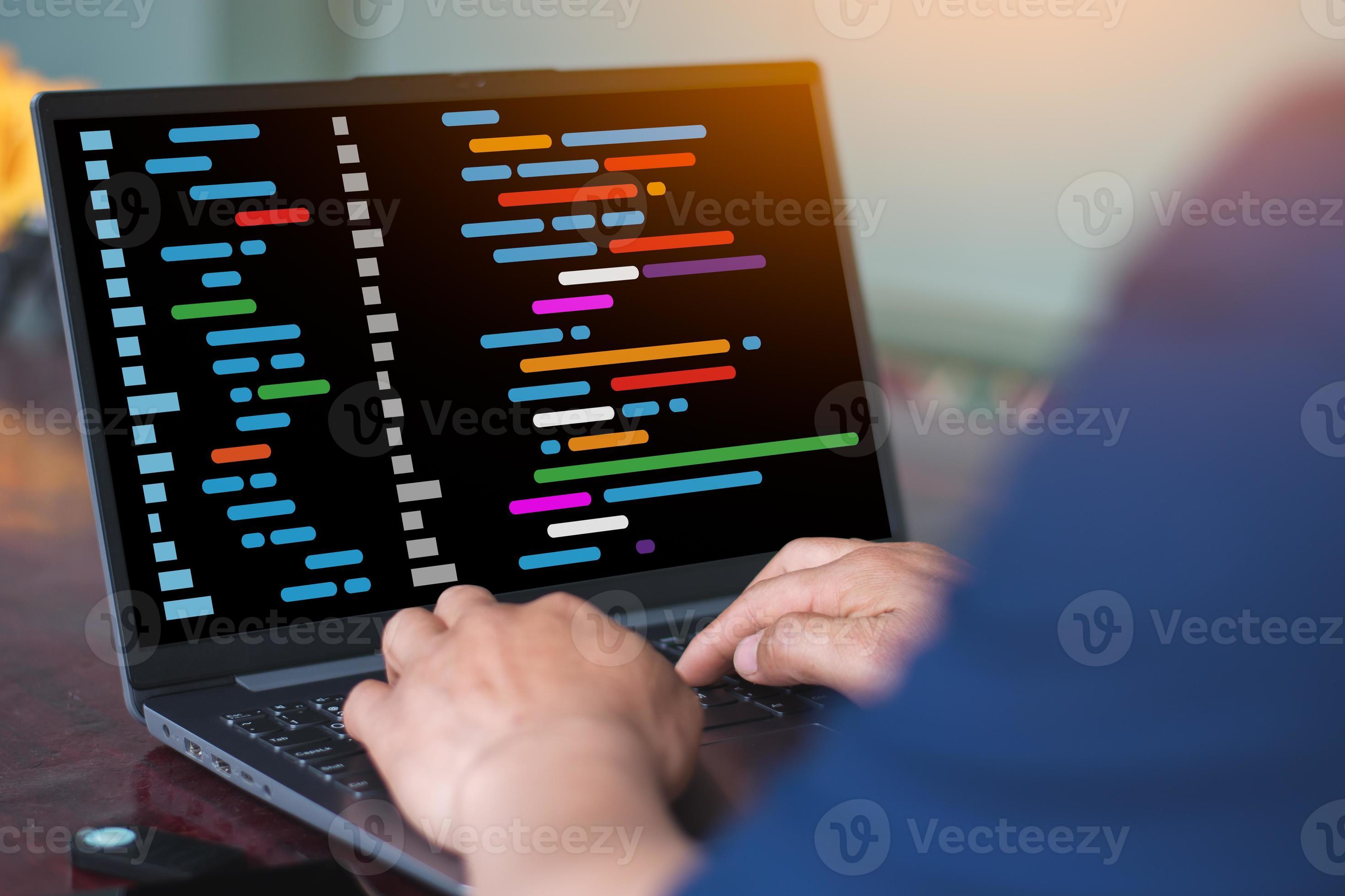 A man is typing on the laptop with virtual code graphic on screen ...