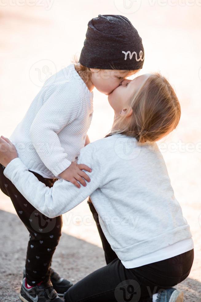 Little sisters kissing 20470650 Stock Photo at Vecteezy Little sisters kissing 20470650 Stock Photo at Vecteezy