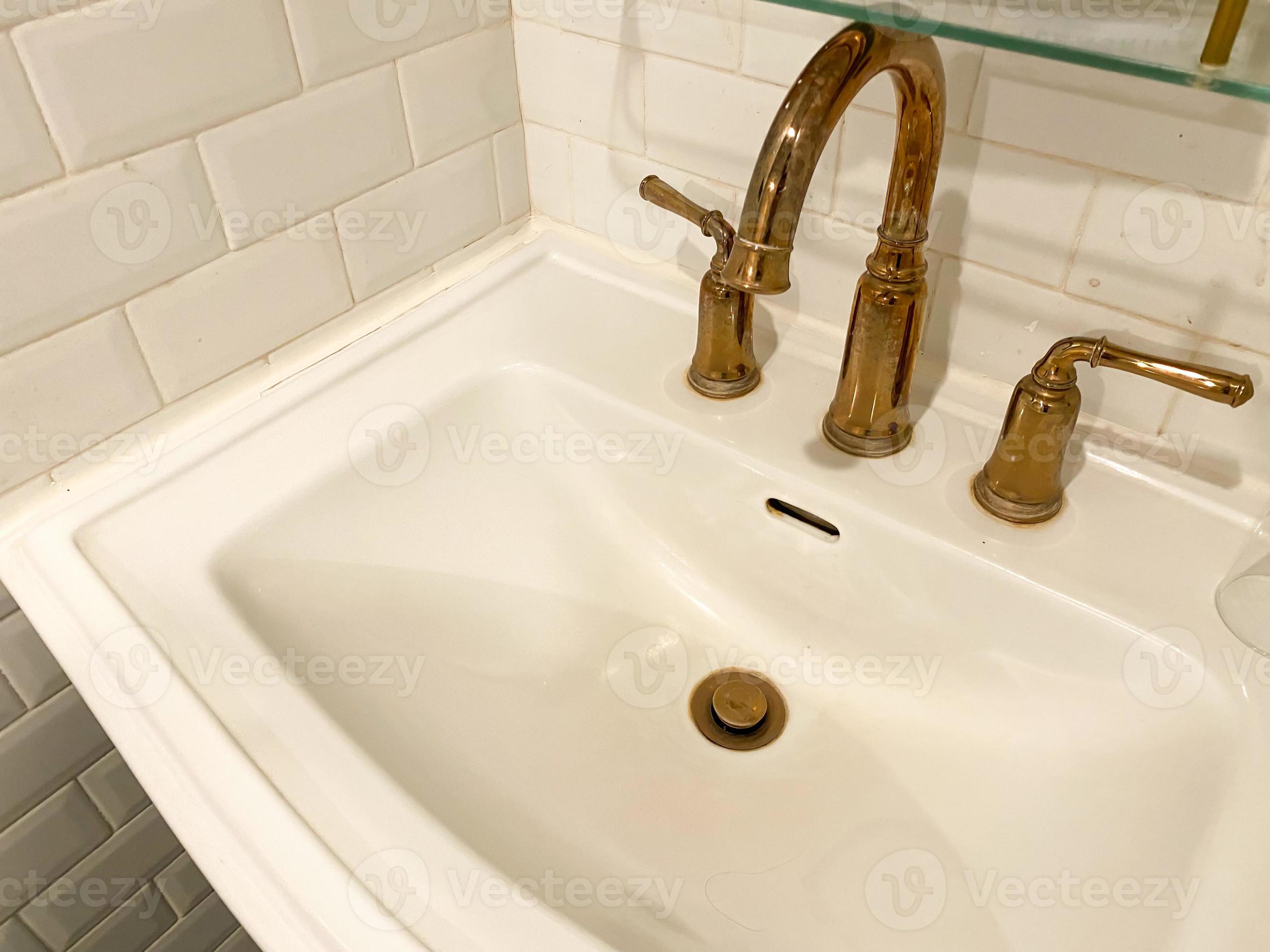 Interior Of Bathroom With Retro Classic Washbasin And Gold Faucet