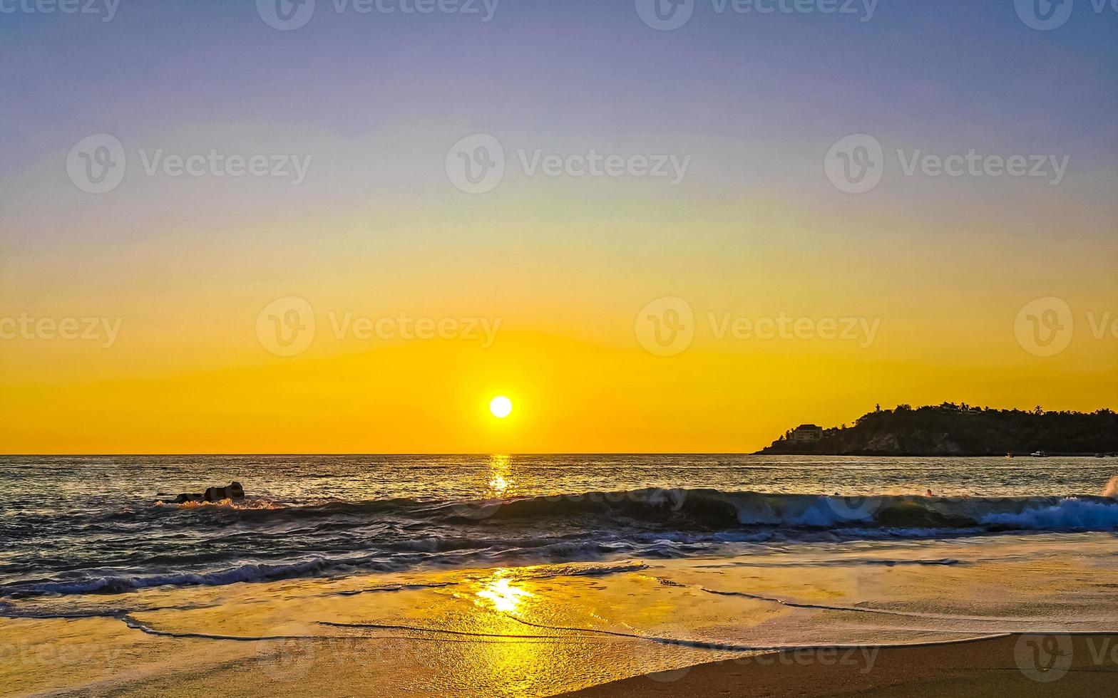Colorful golden sunset big wave and beach Puerto Escondido Mexico ...