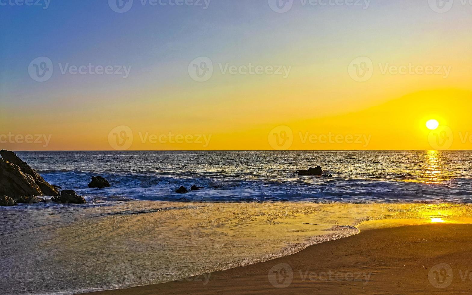 Colorful golden sunset big wave and beach Puerto Escondido Mexico ...
