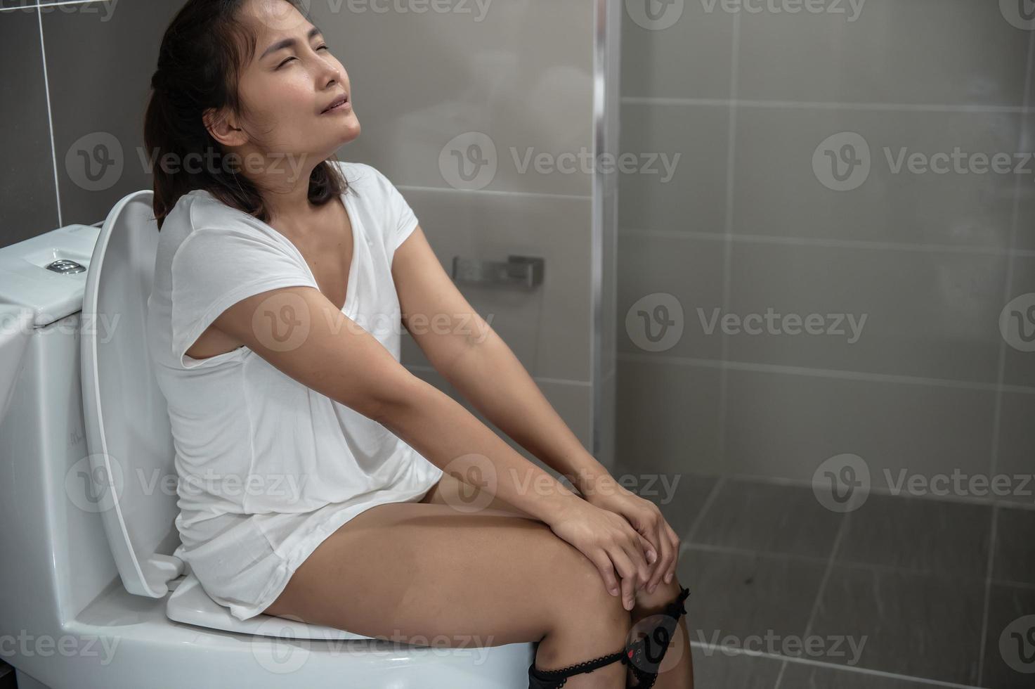 Have Problems With Excretion Conceptan Asian Woman Sits On The Toilet Bowlconstipation And A