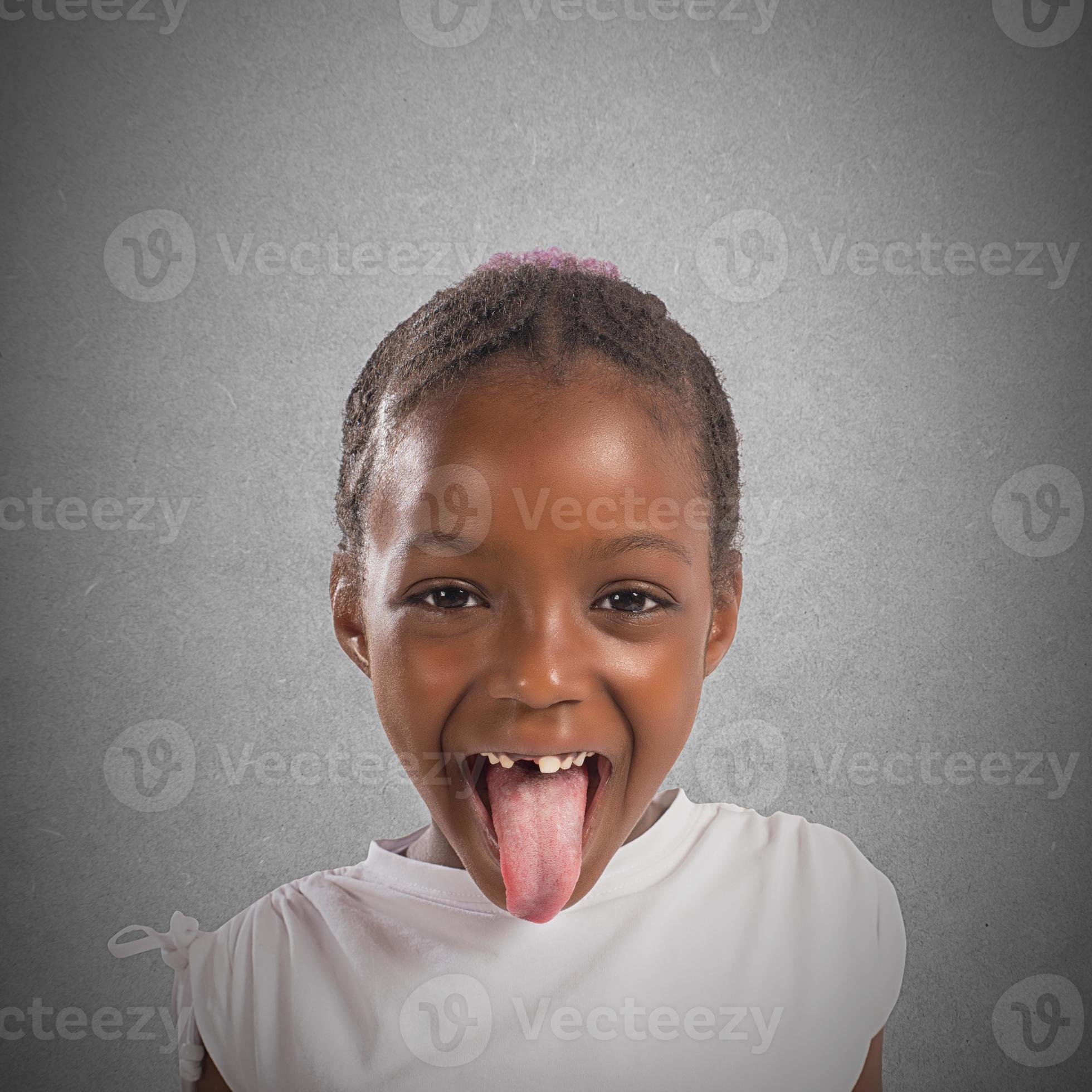 Little girl makes a tongue 20567509 Stock Photo at Vecteezy