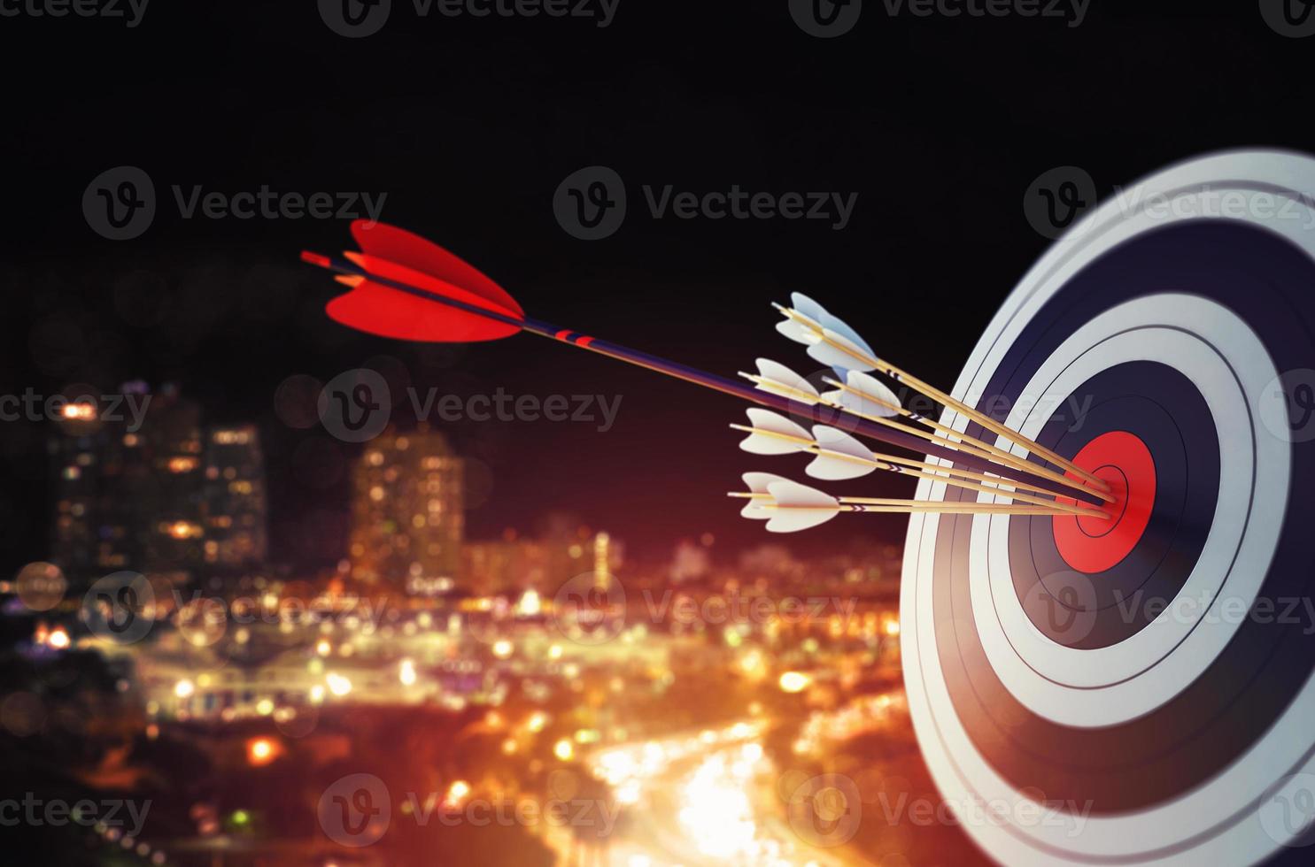 Arrow hit the center of target with modern skyline background. Business target achievement ...