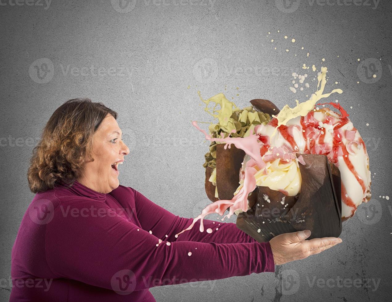 Woman entranced by sweet 20627344 Stock Photo at Vecteezy