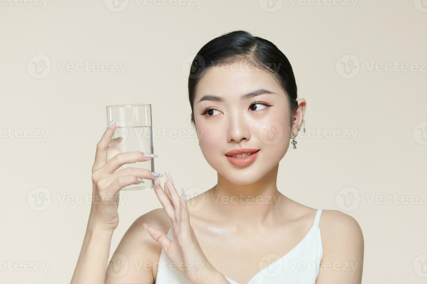 Young smiling woman holding water glass. 20645728 Stock Photo at Vecteezy