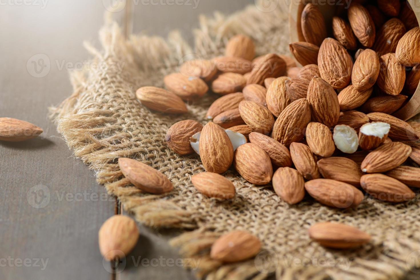 Almonds nut on wood background. They are highly nutritious and rich in healthy fats 20828606 ...