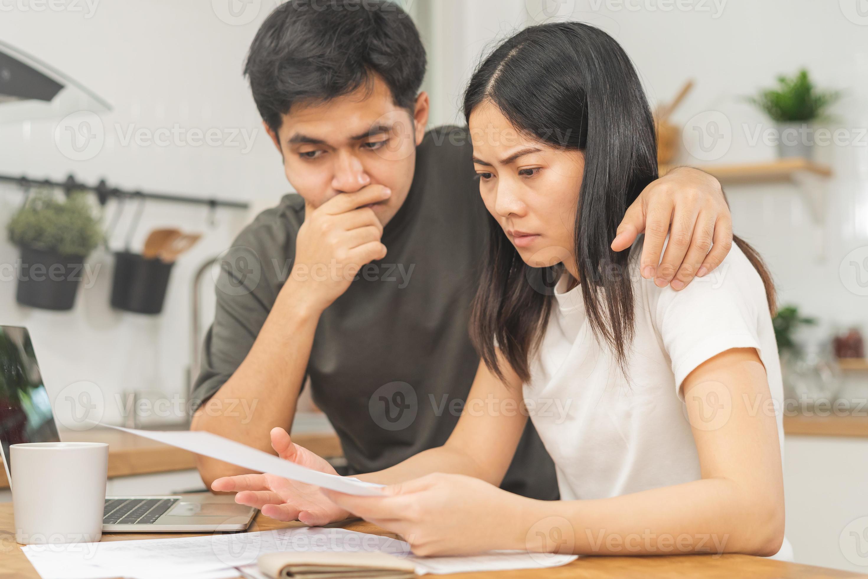 Stressed asian young couple family, wife and husband confused by ... Stressed asian young couple family, wife and husband confused by ...