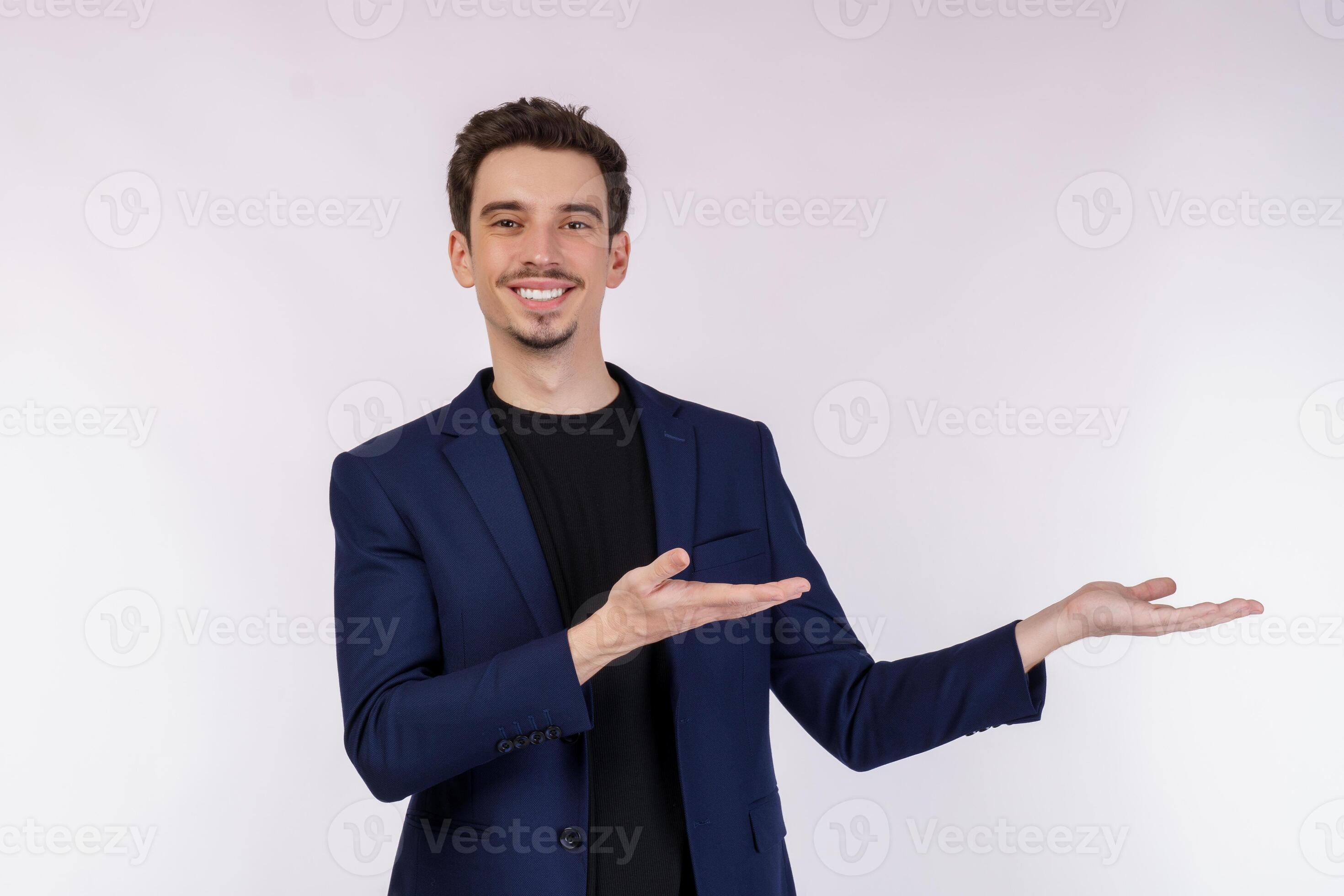 Portrait of happy smiling young businessman presenting and showing your ...
