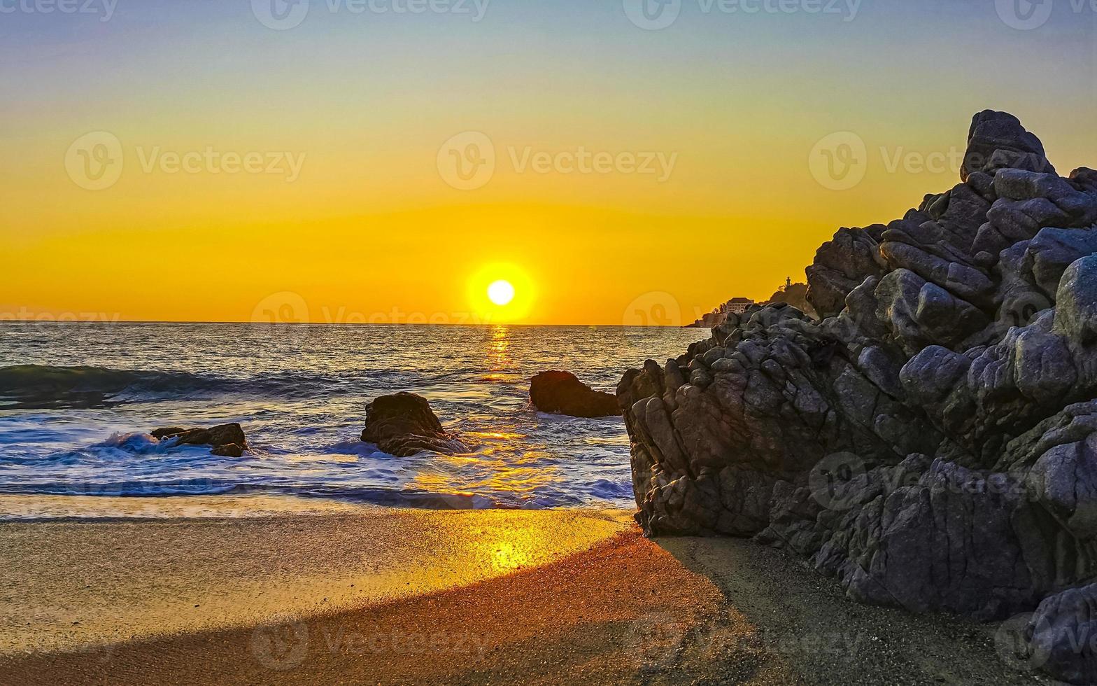 Colorful golden sunset big wave rocks beach Puerto Escondido Mexico ...