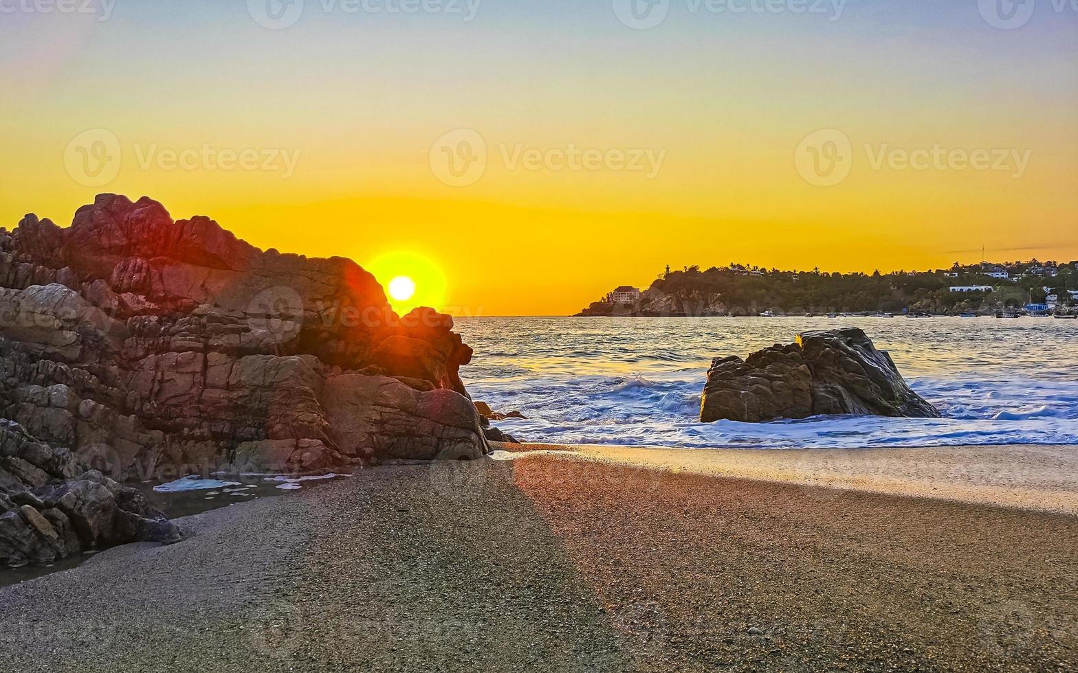 Colorful golden sunset big wave rocks beach Puerto Escondido Mexico ...